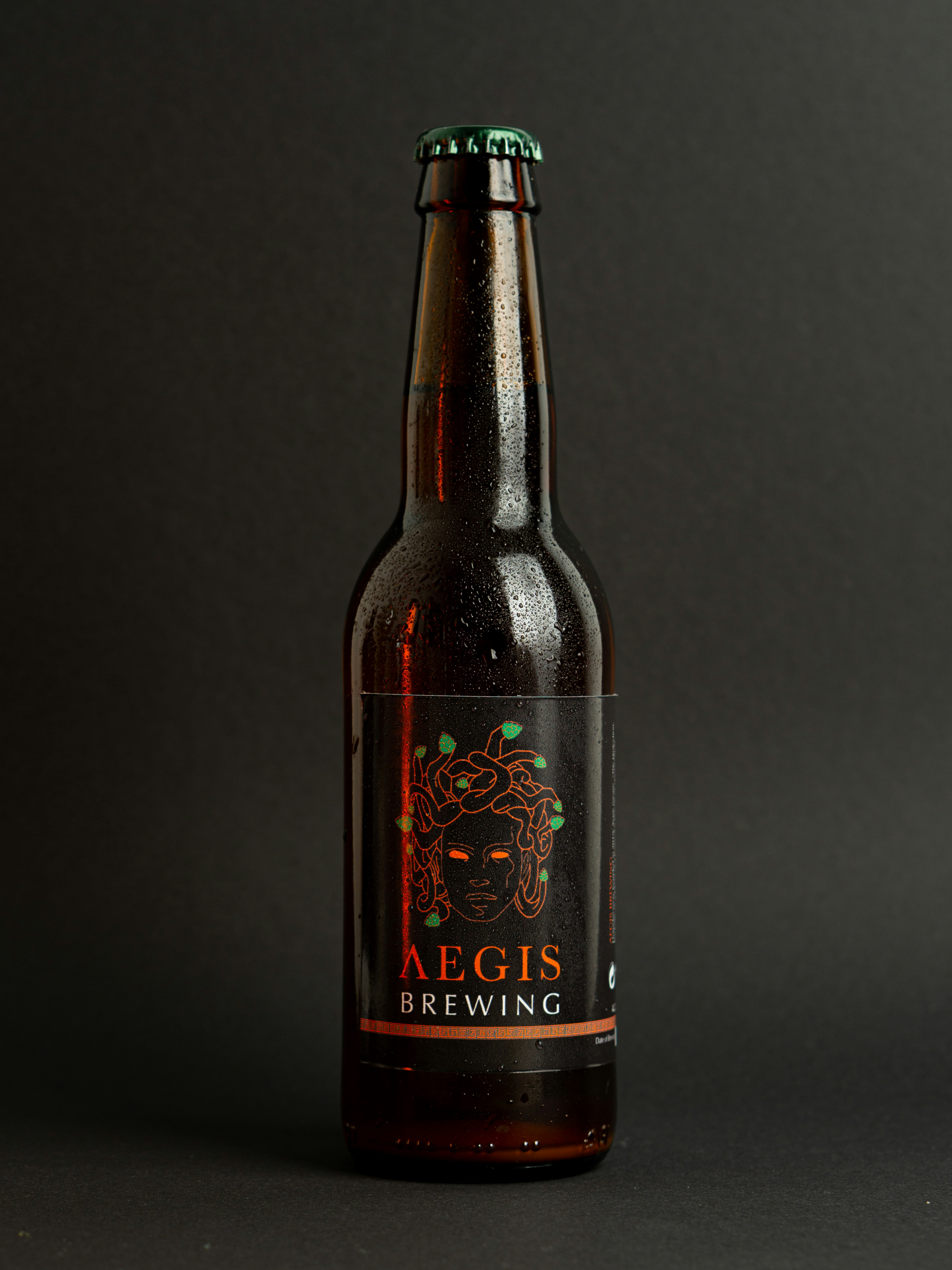 black and brown labeled bottle