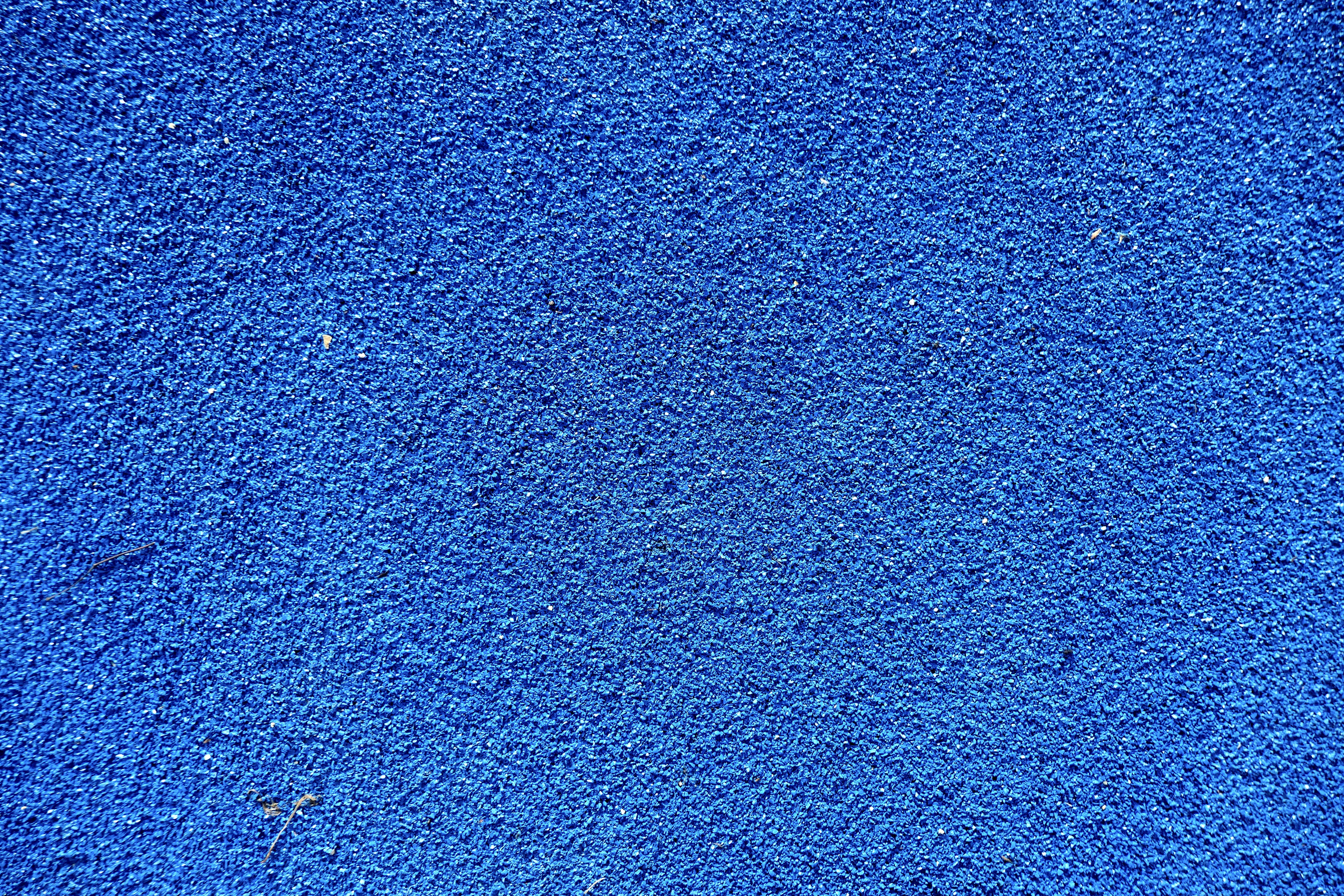 Textured blue surface with a rich, uniform appearance, showcasing the intricacies of color and material. Perfect for backgrounds or abstract art.