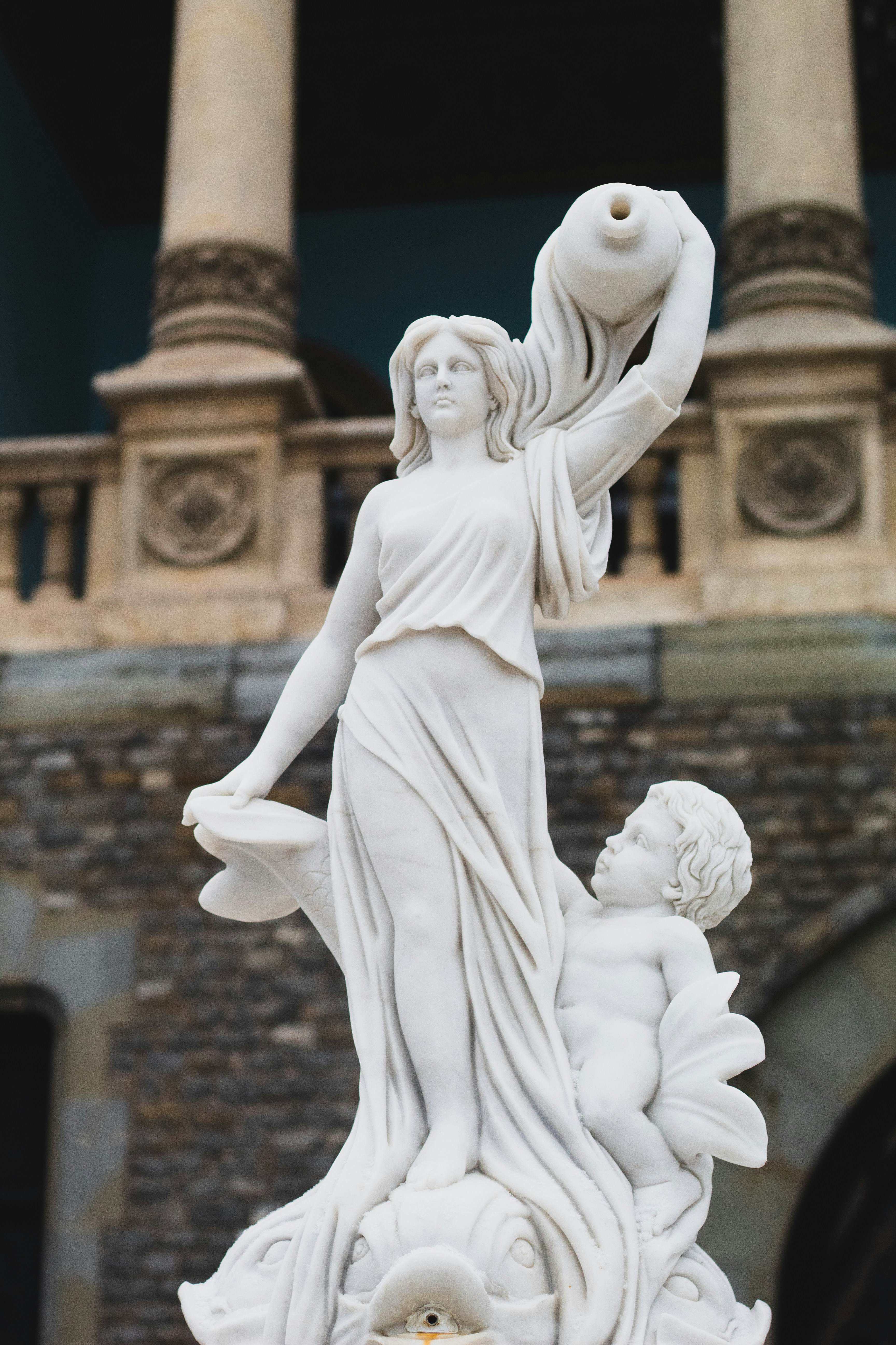 Statue at Cantacuzino Castle | white angel statue during daytime