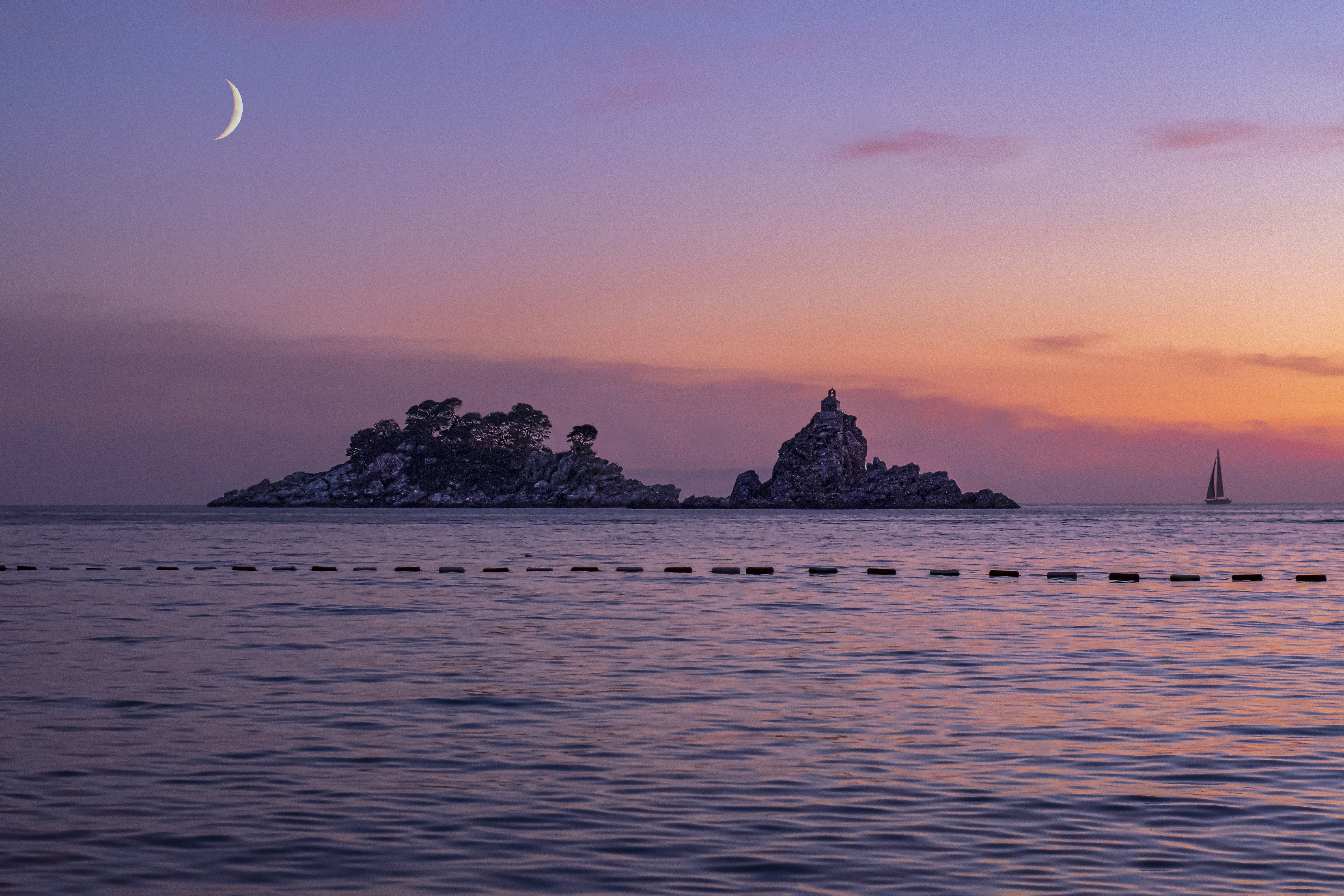 Dusk Over Quiet Sea: Crescent Moon, Islands, and a Sail
