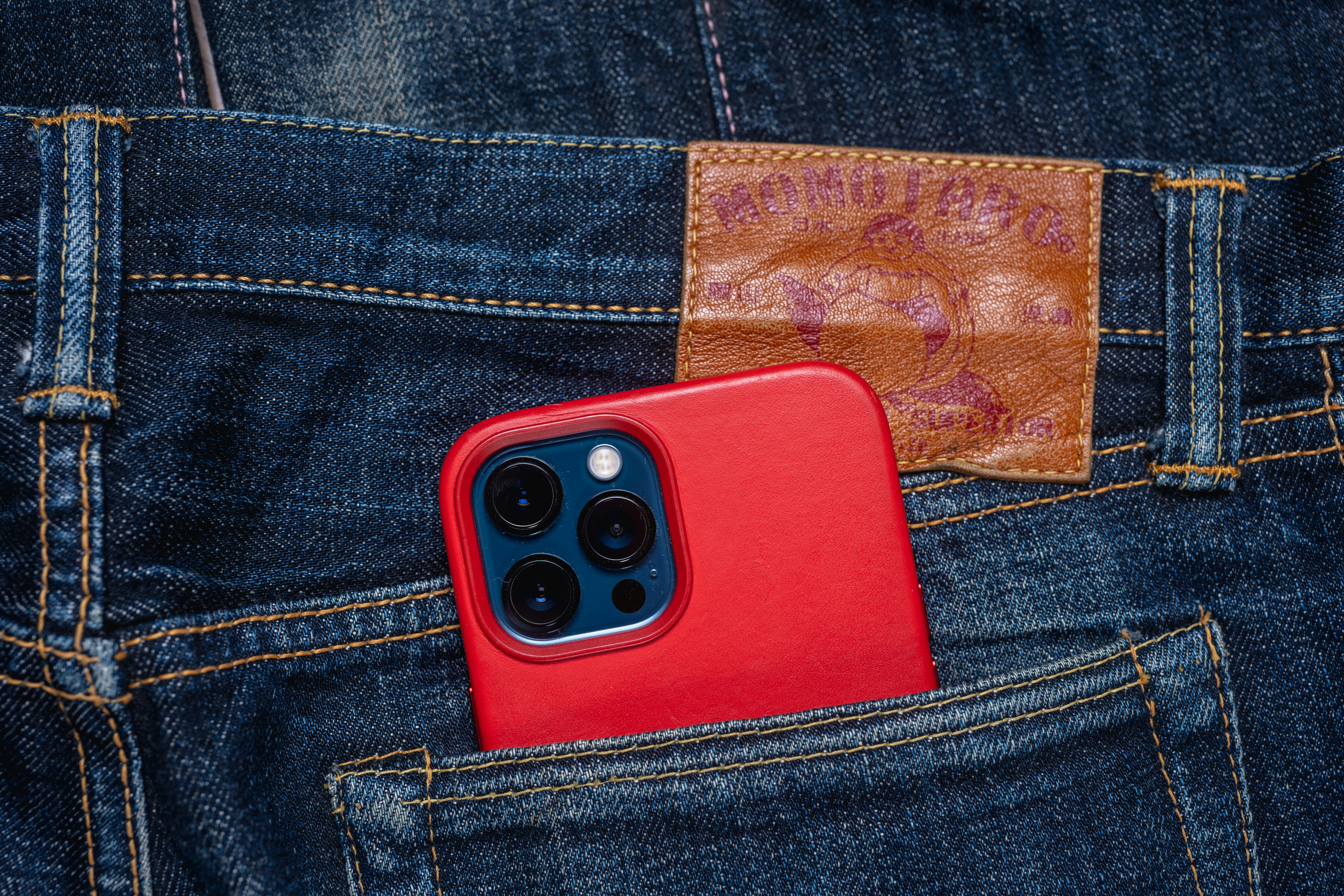 Red and black remote control on blue denim jeans photo – Free Red Image ...