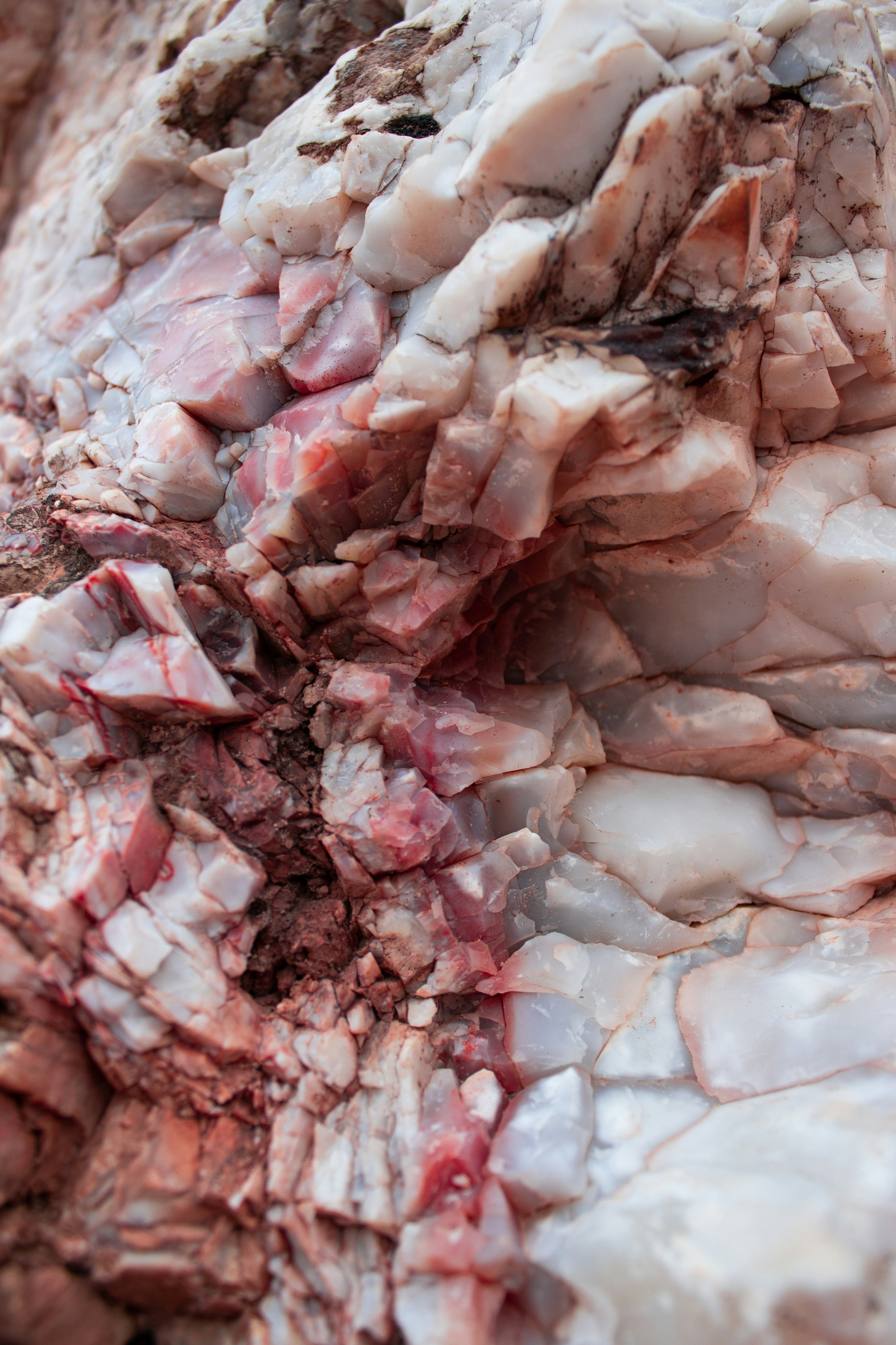 Oxblood Veins: A Close-Up of Stone and Marble in Rough Hewn Form