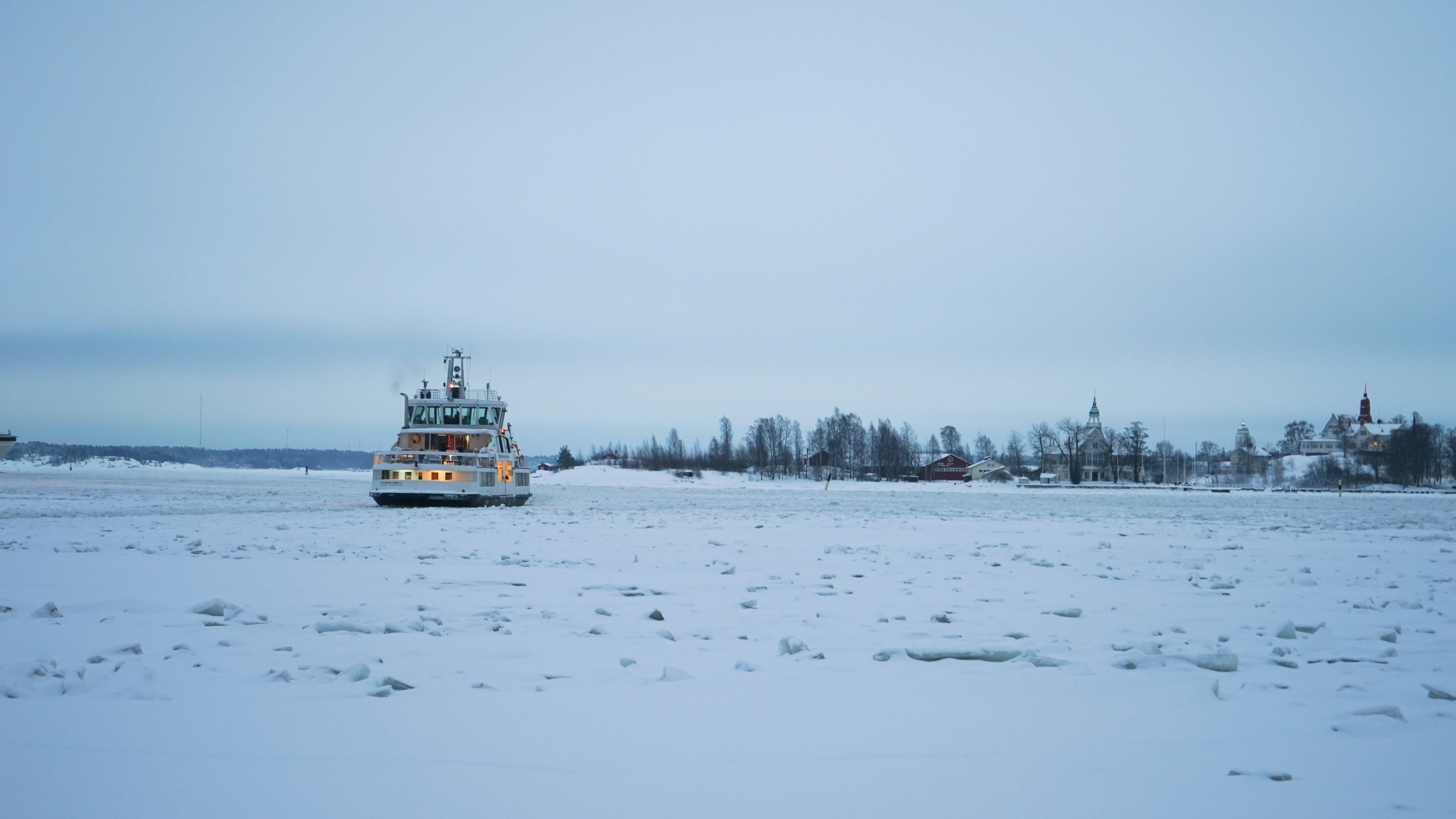 Icebound Ferry Skimming a Snow-Quiet Harbor