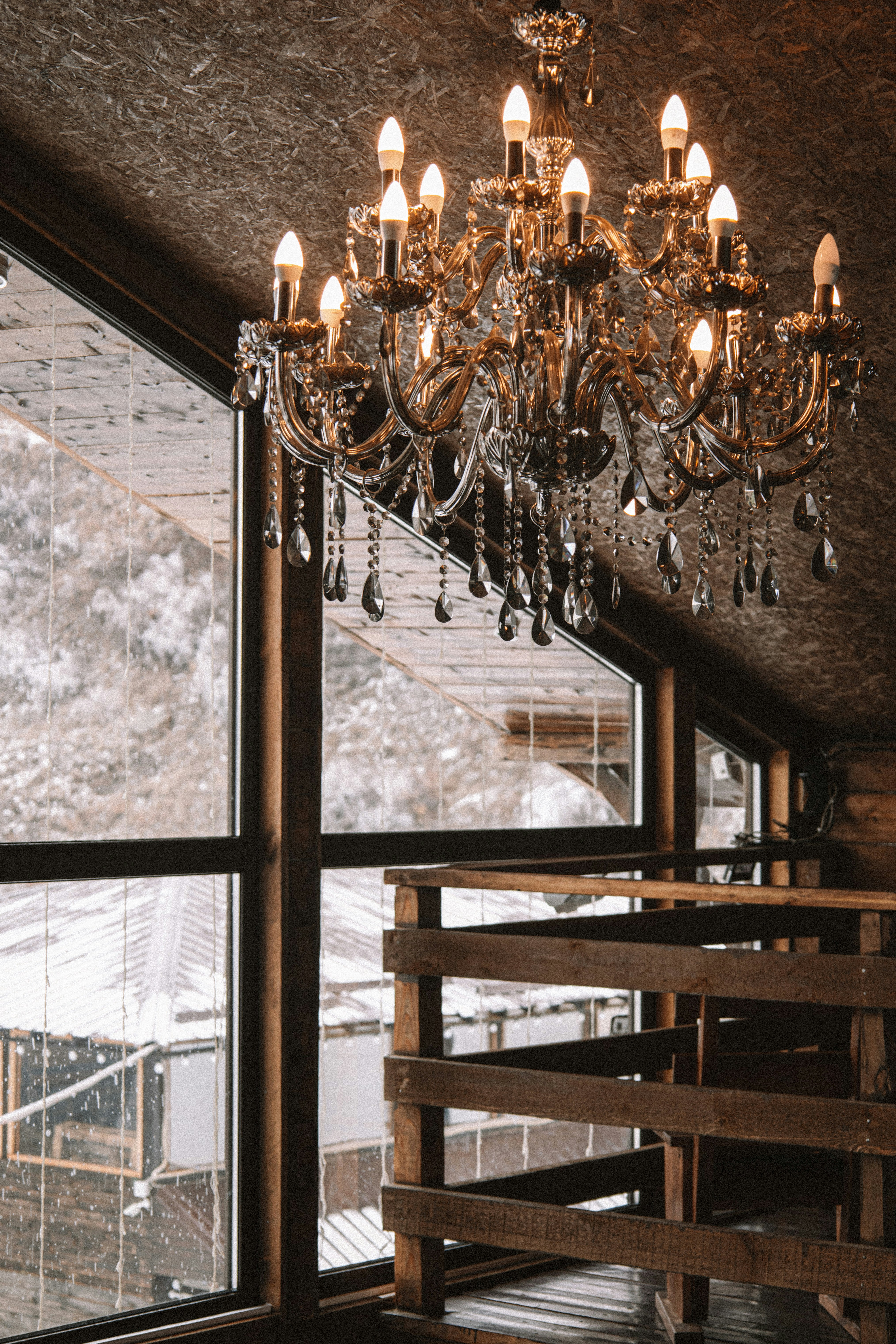 Chandelier Glow Over Rustic Loft
