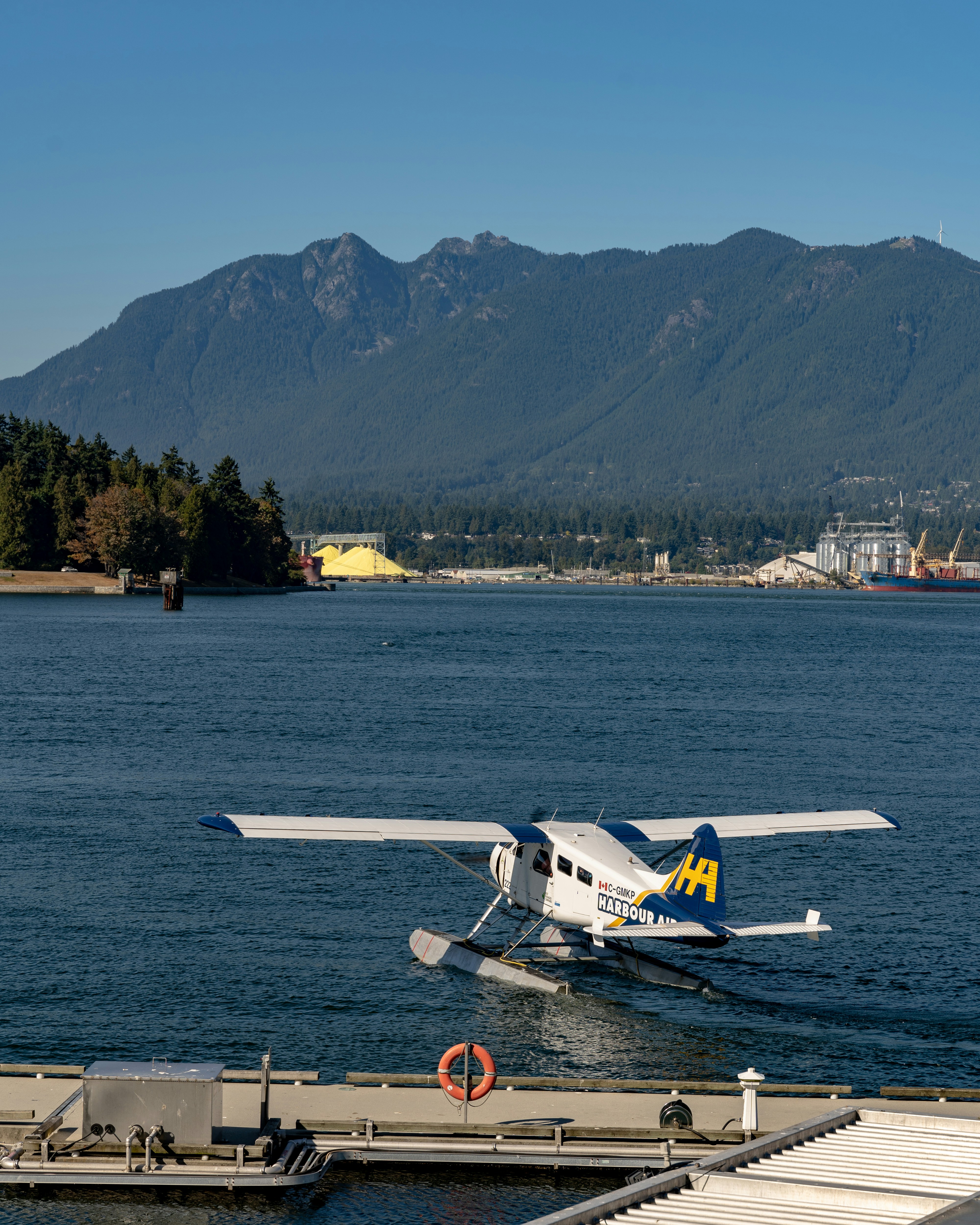Floating Sky: A Seaplane Awaits on a Calm Fjord