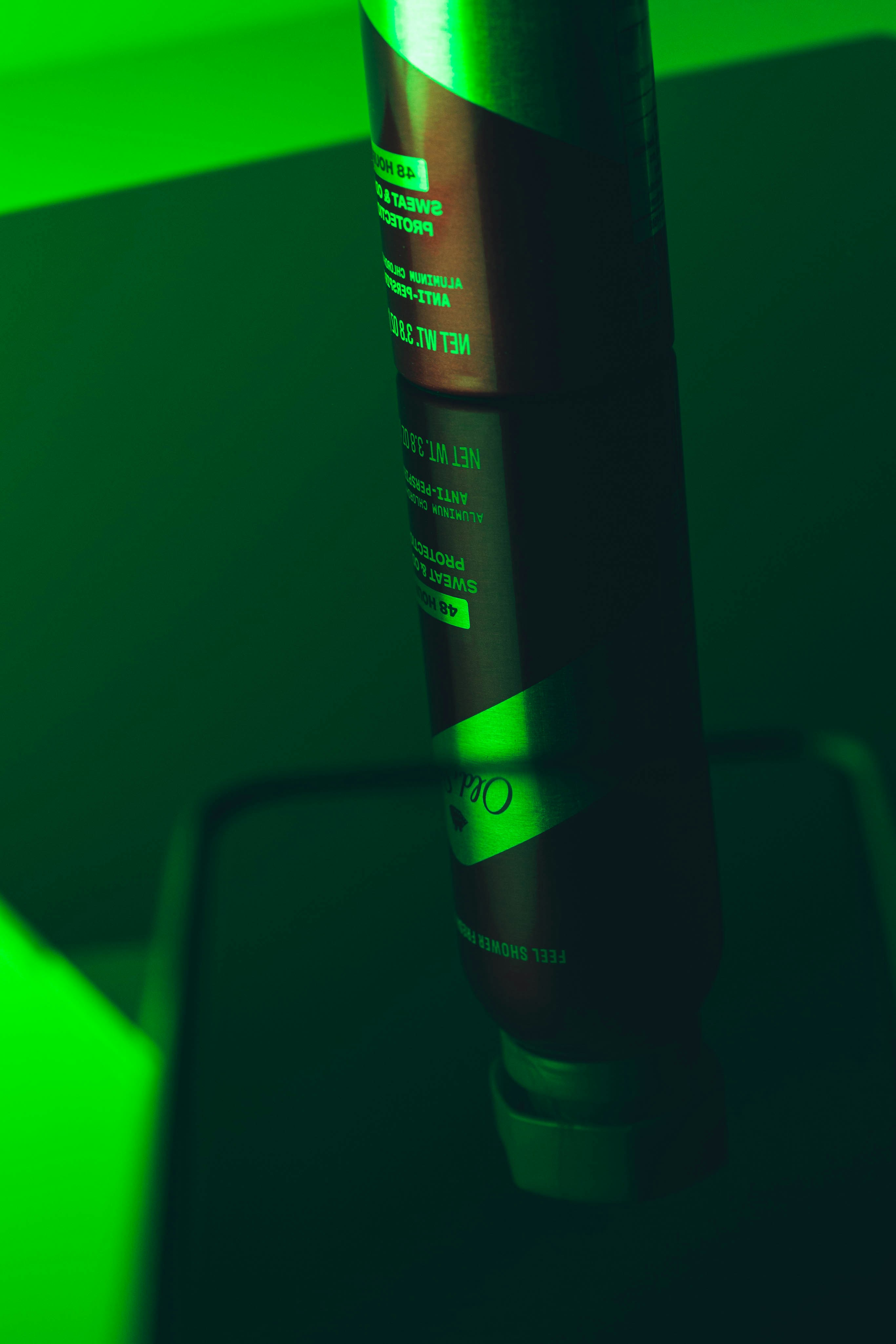 blue and green labeled bottle