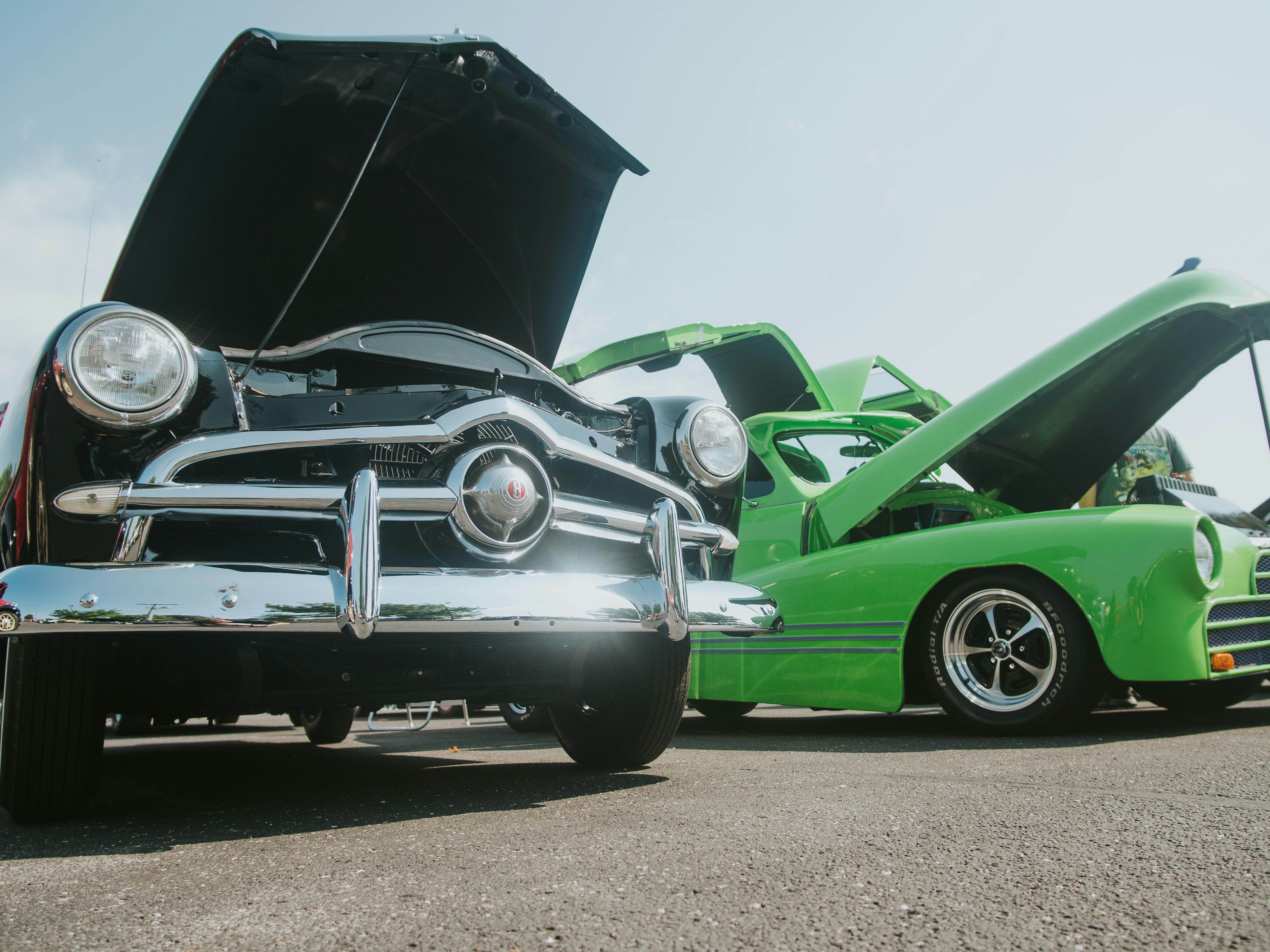 Classic Chrome Meets Modern Green: A Car Show Contrast