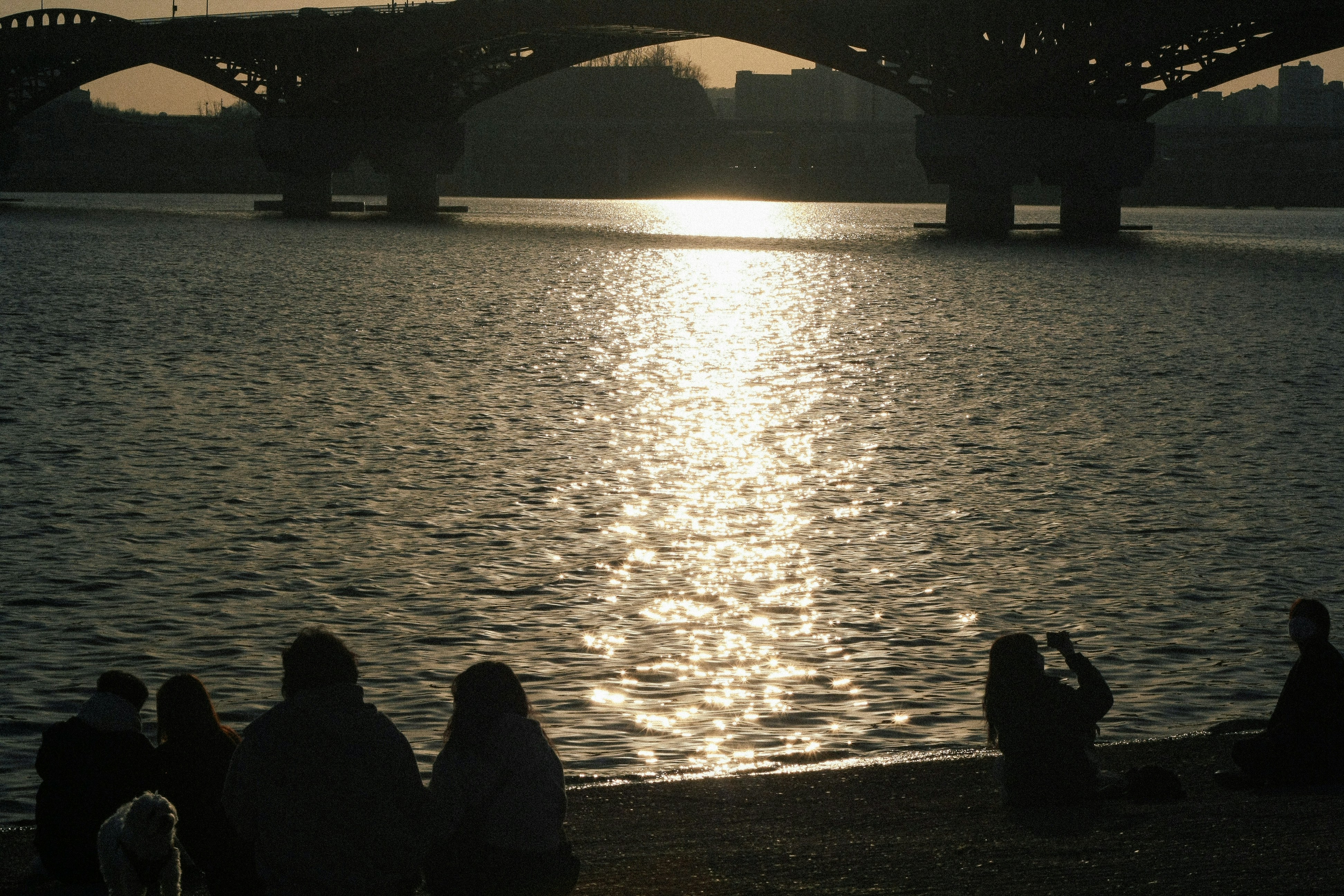 Bridge Glow: Silhouettes and a River of Light