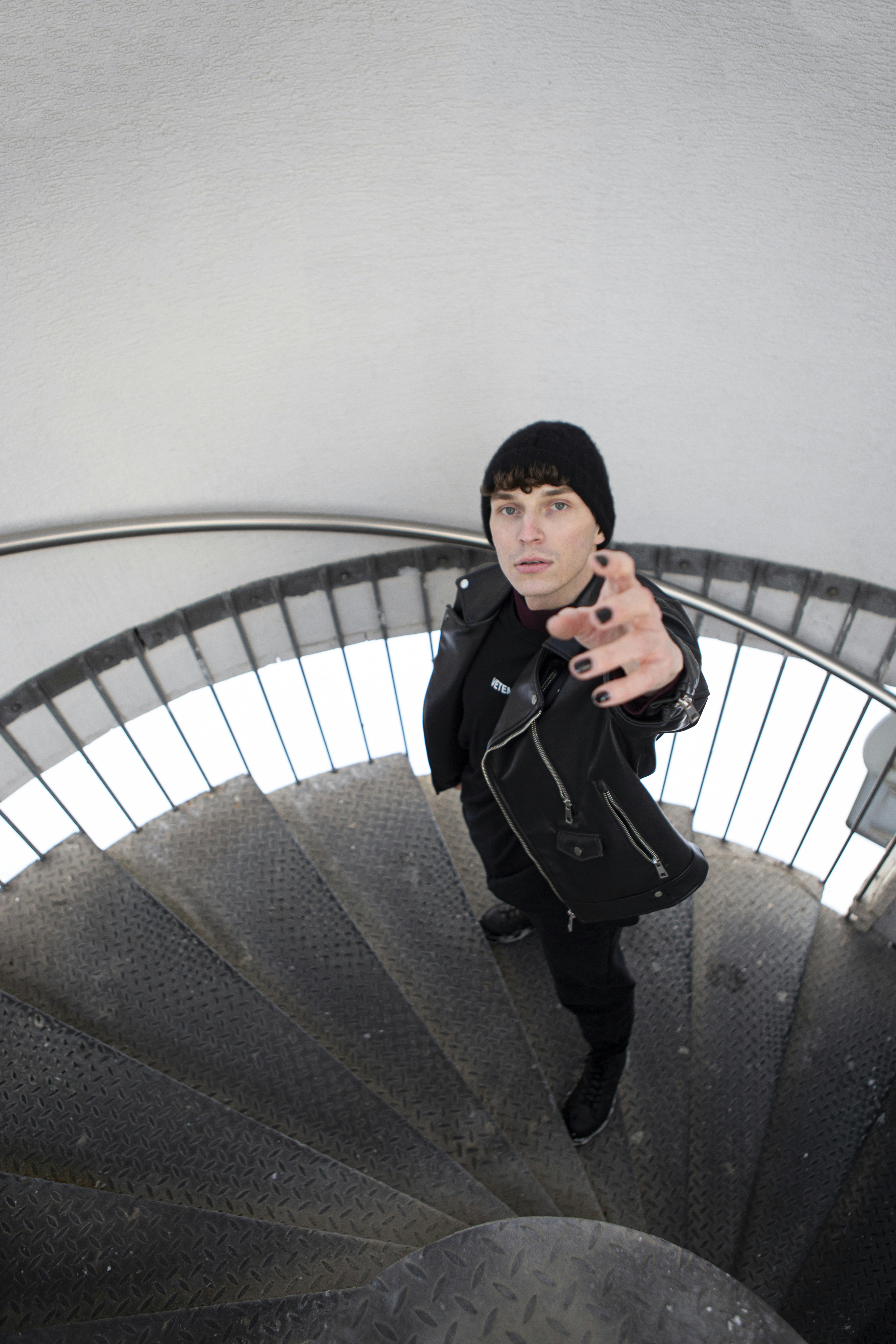 Outstretched Gaze from a Steel Spiral Staircase