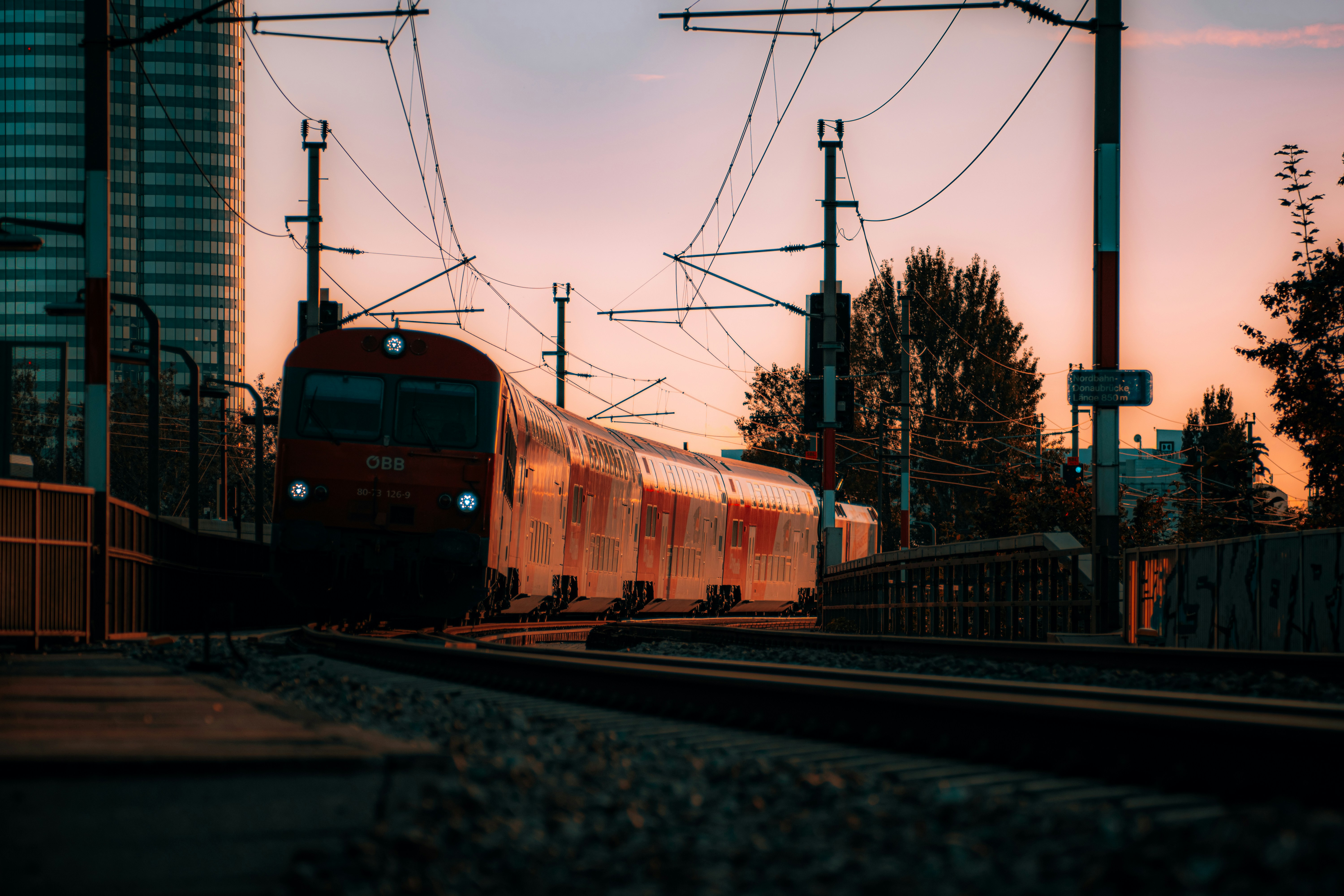 Red and yellow train on rail tracks during daytime photo – Free Train ...
