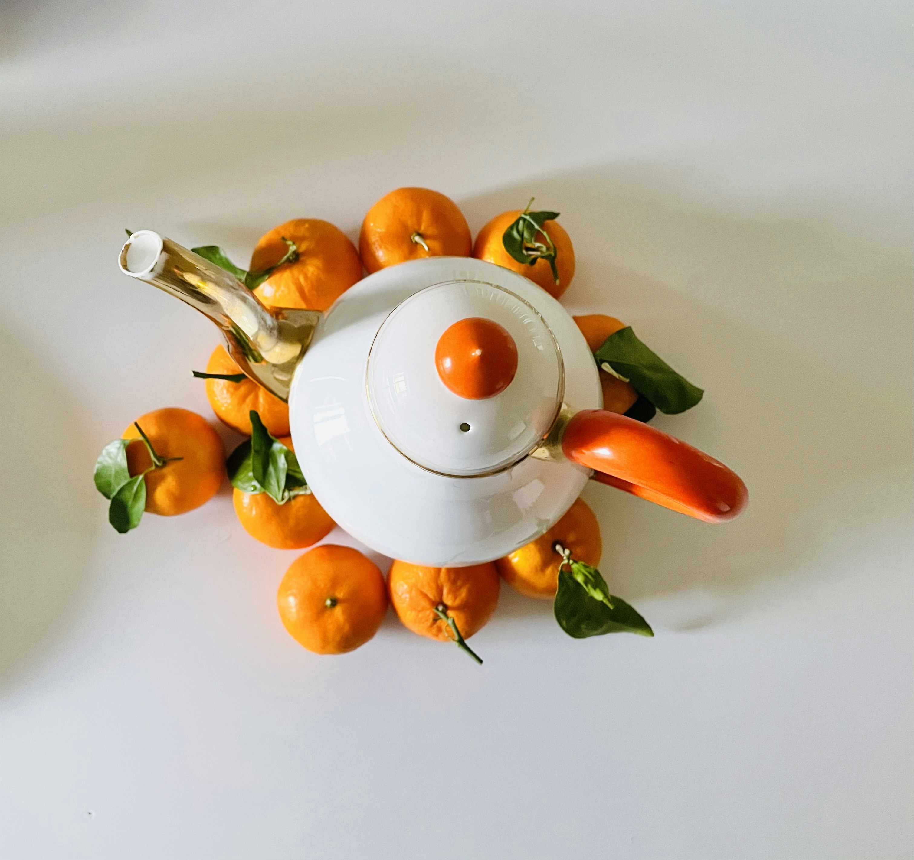 white and orange tomato toy