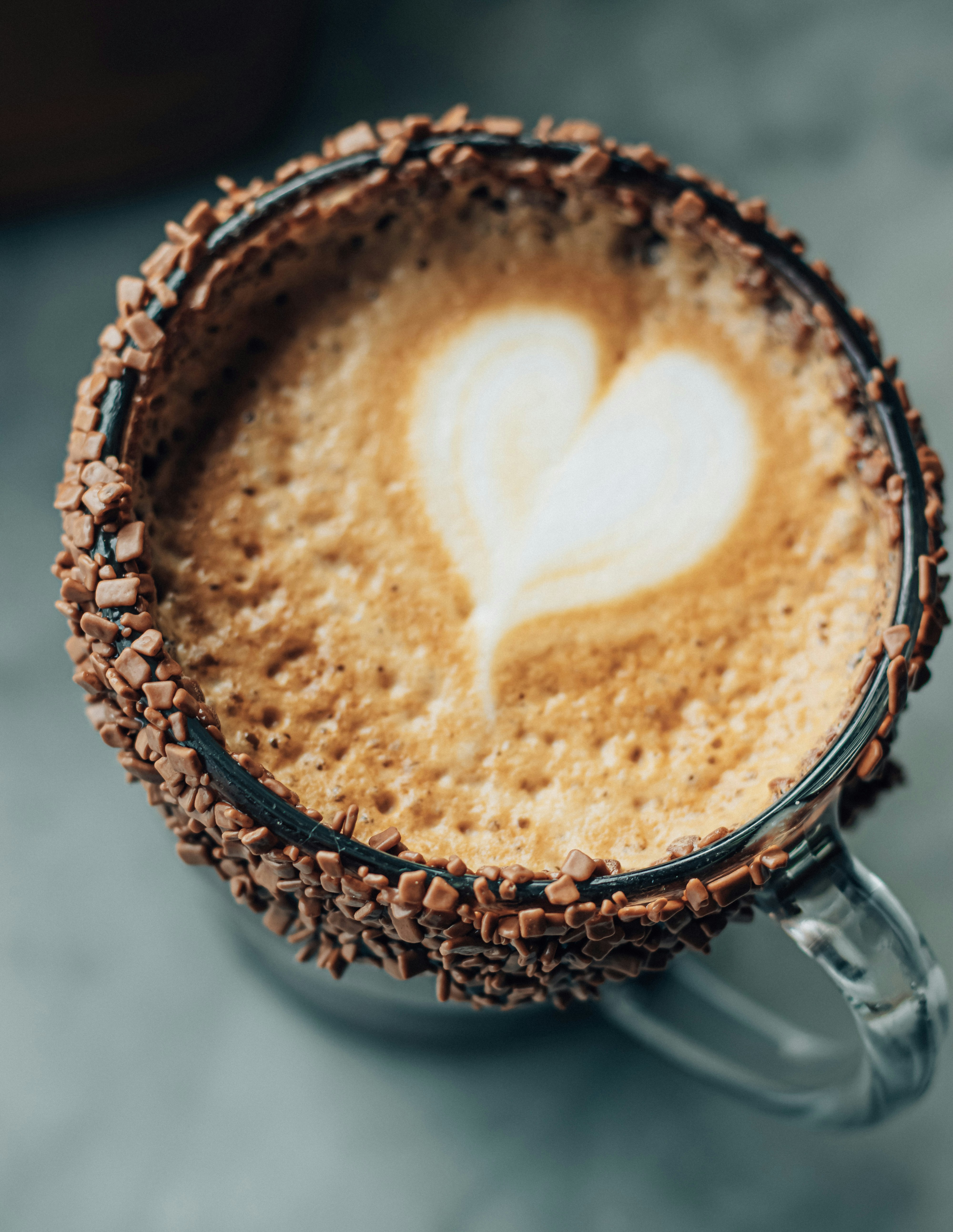 Brown and white heart shaped coffee art in clear glass mug photo – Free ...