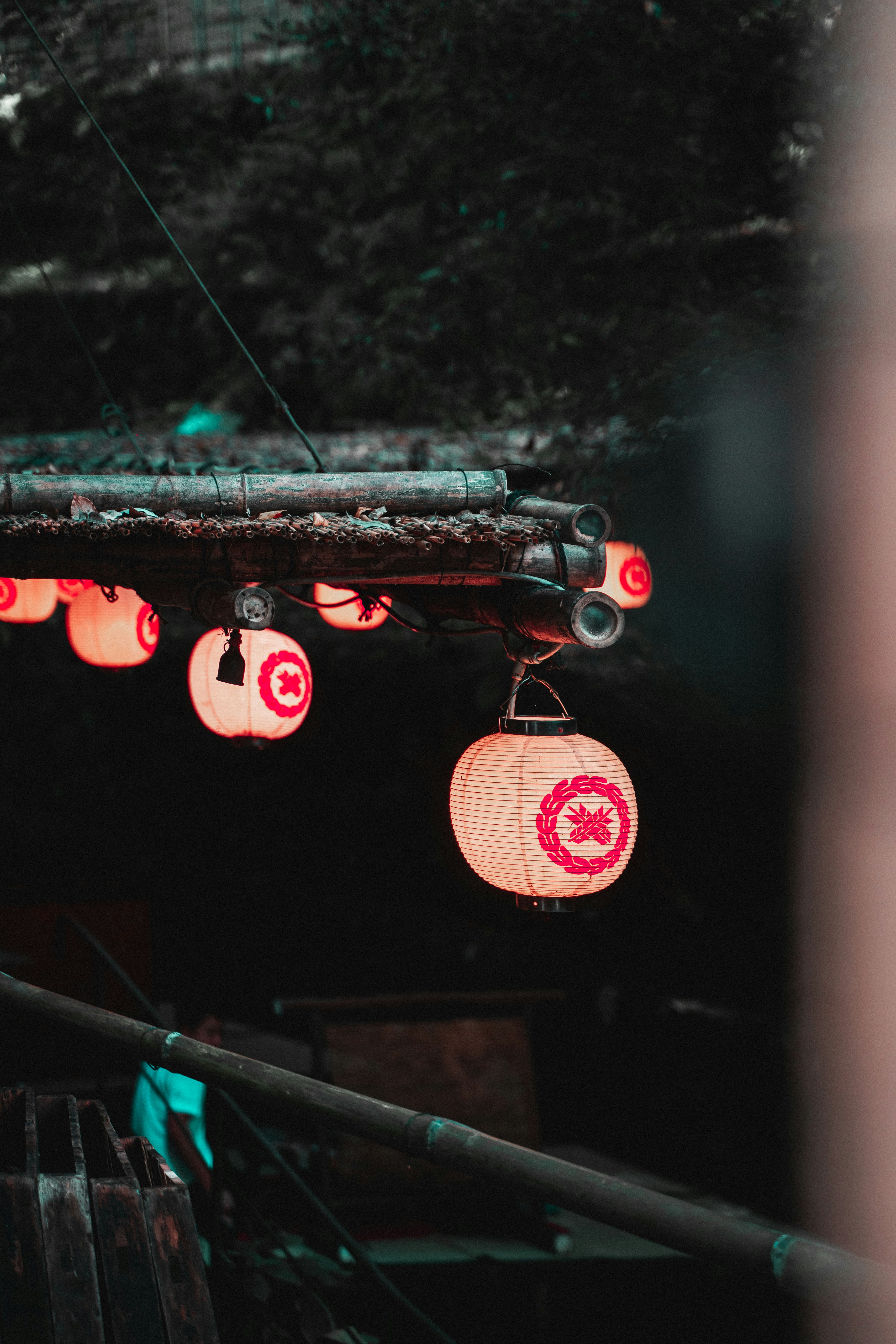 Red Lanterns on a Mossy Beam: A Lantern-Lit Nook in Quiet Night