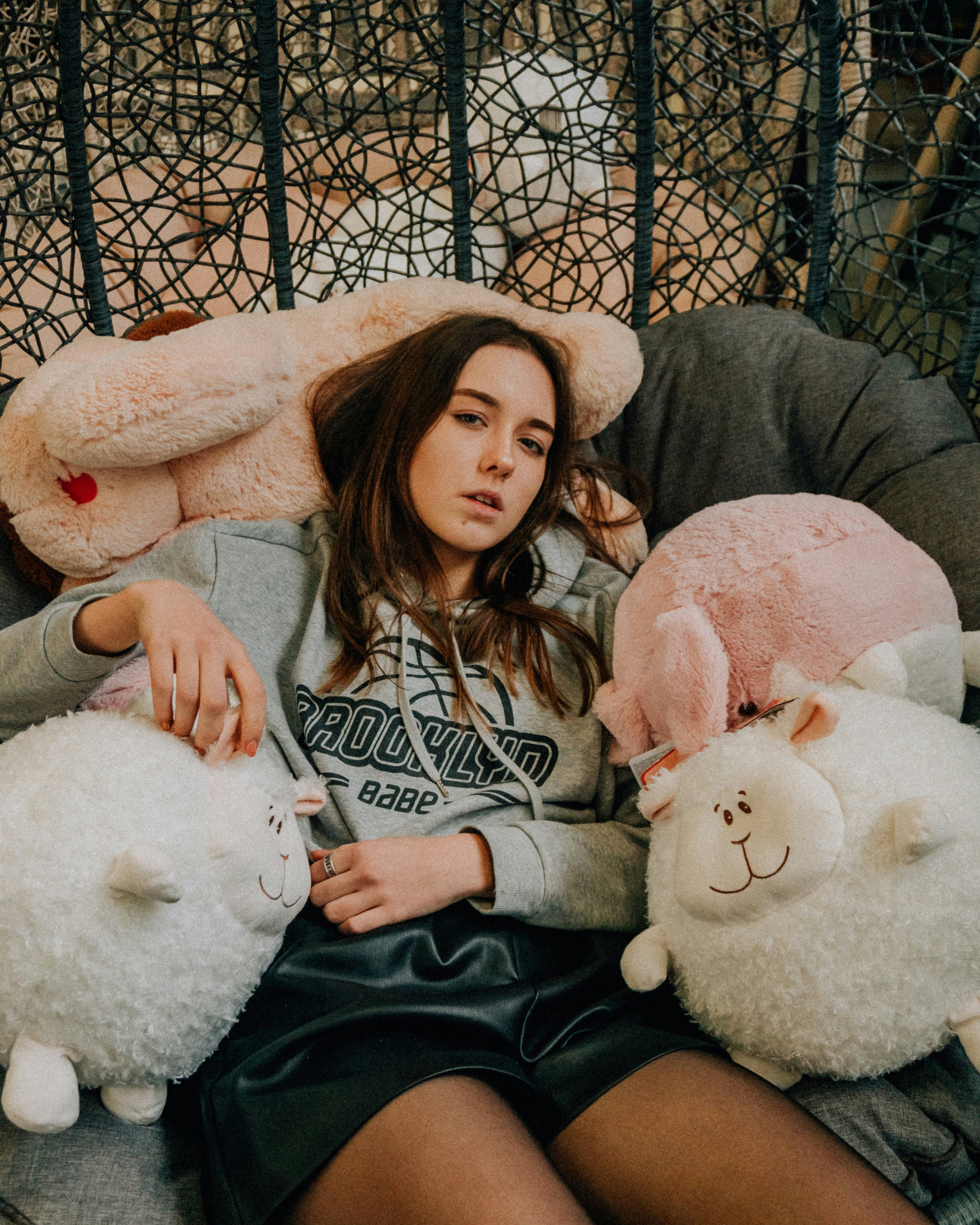 Cosy Repose: A Teen Surrounded by Plush Companions