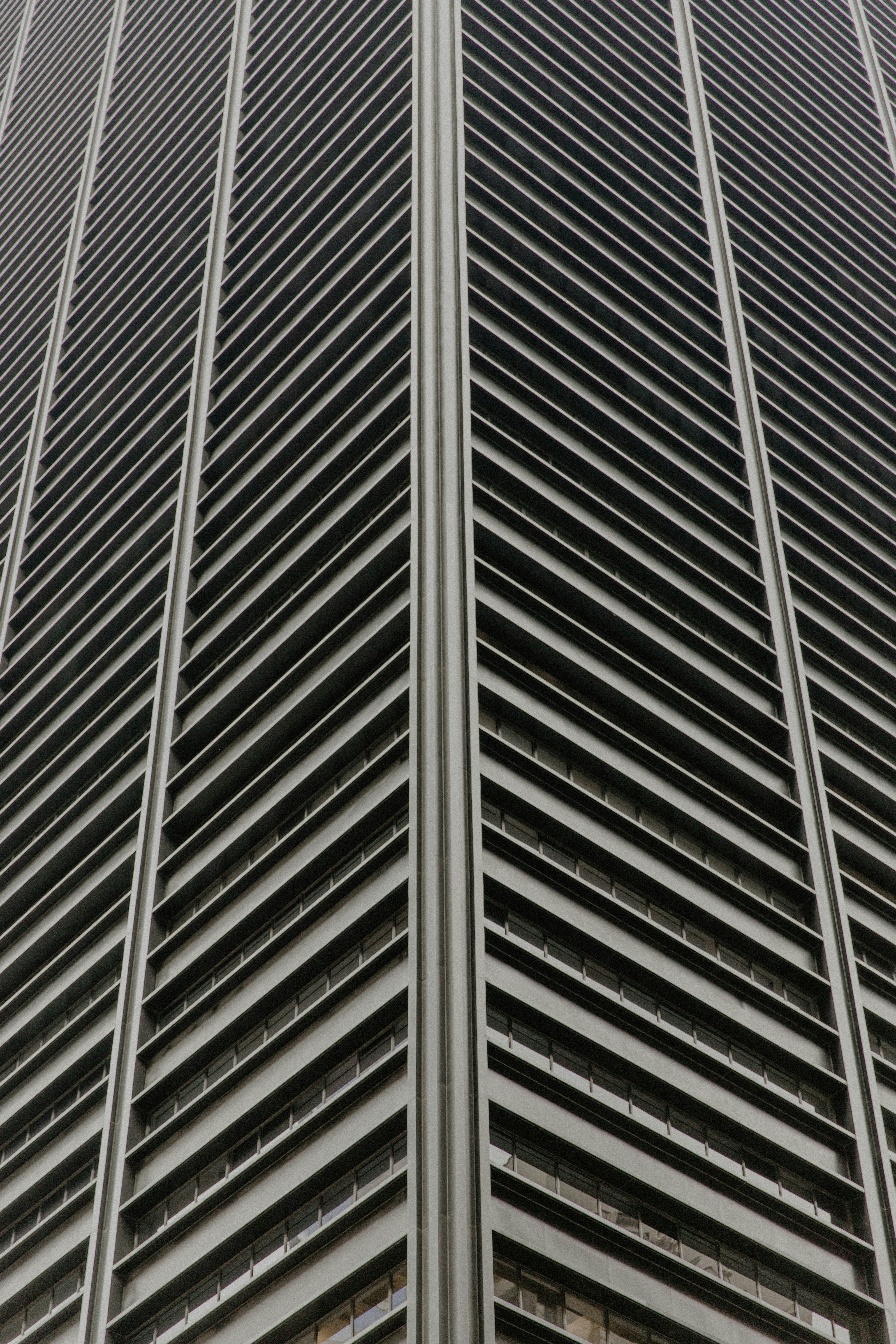 Ridgework in Steel: A Vertical Chevron Facade Close-Up
