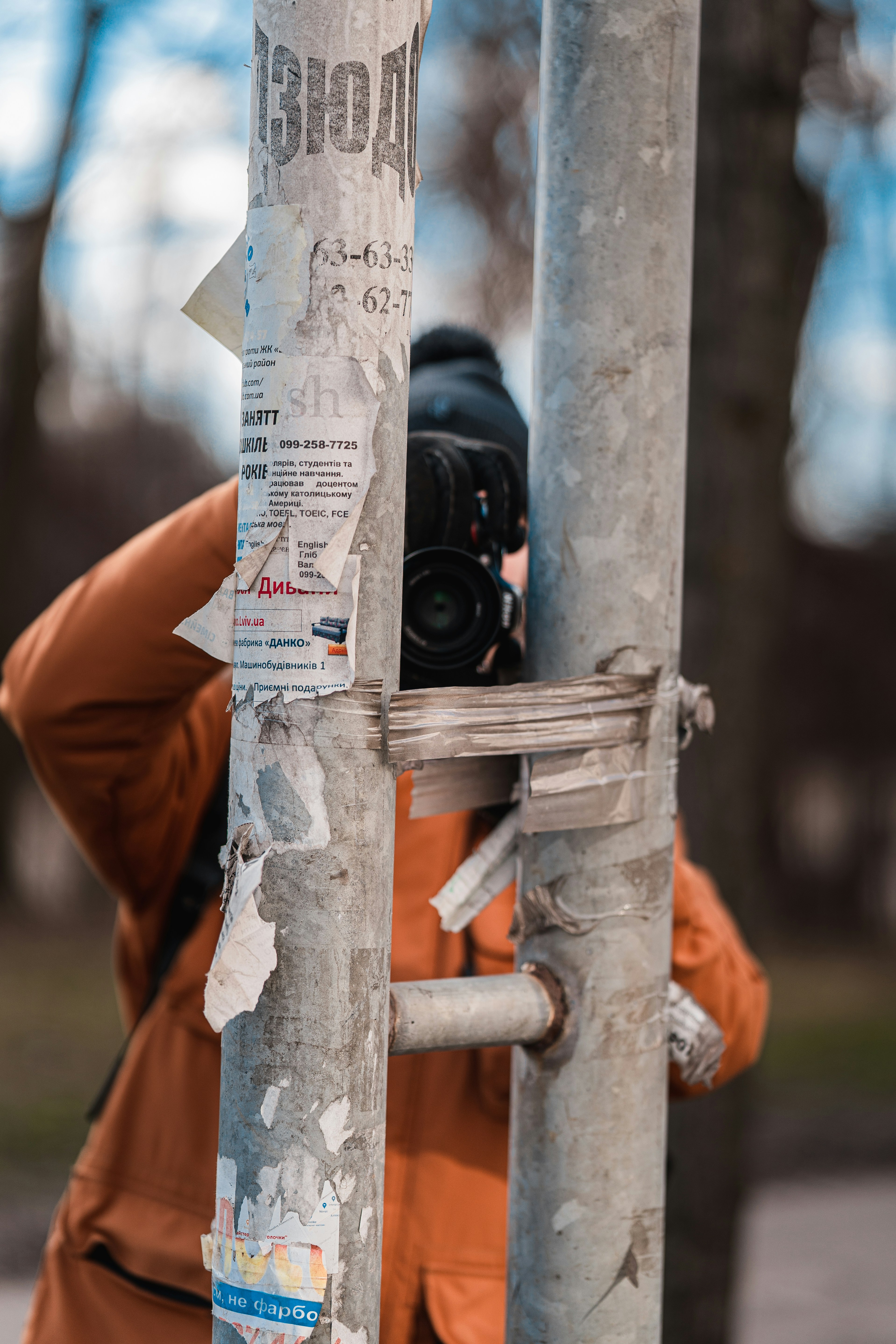 Through the Cage of Tape and Rail: The Photographer in Focus