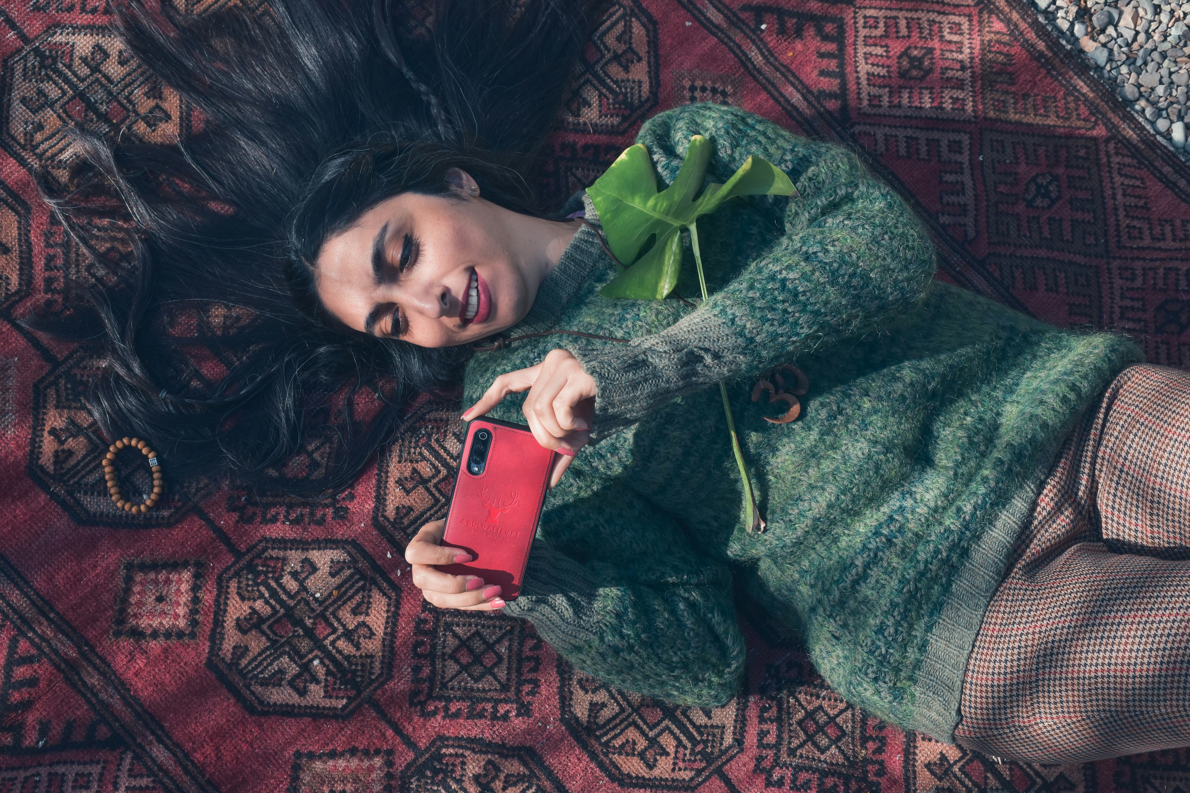 Electric Smile: A Portrait of Joy in a Cozy Green Moment