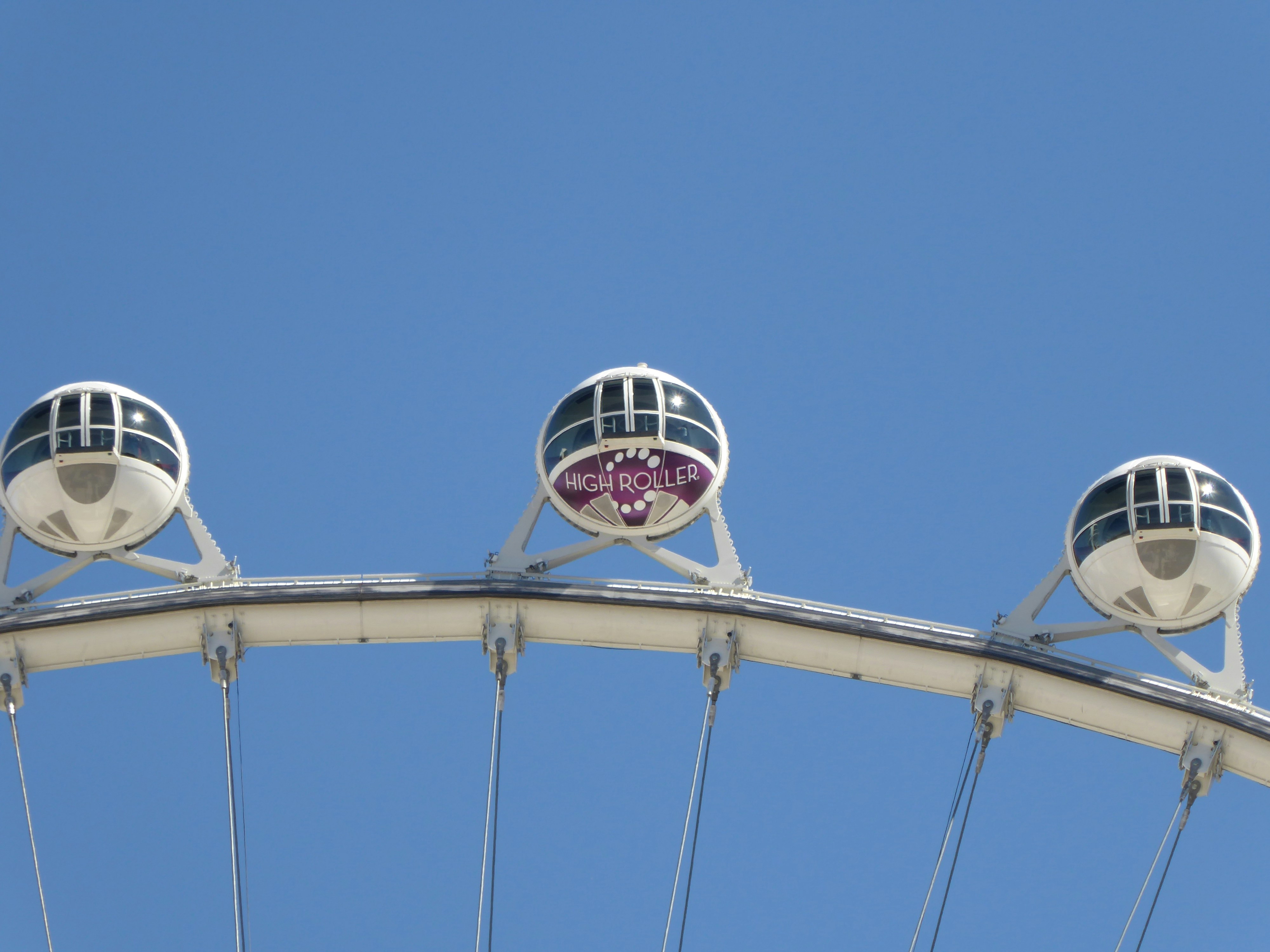 Nothing quite like a ride on the High Roller ride in Las Vegas.  The views from when you reach the top incredible  | white and red ferris wheel under blue sky during daytime