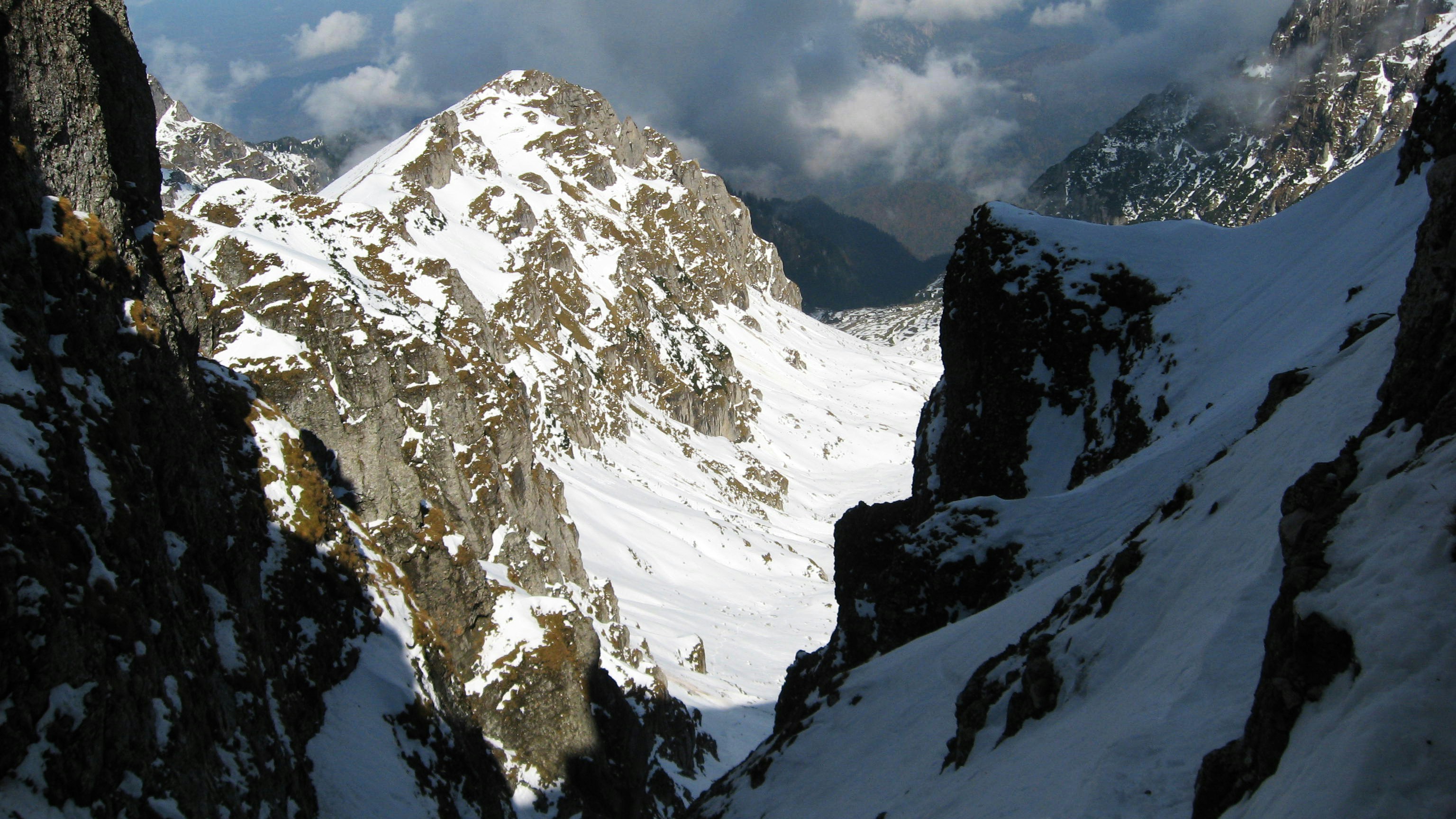 Snow covered mountain under cloudy sky during daytime photo – Free ...