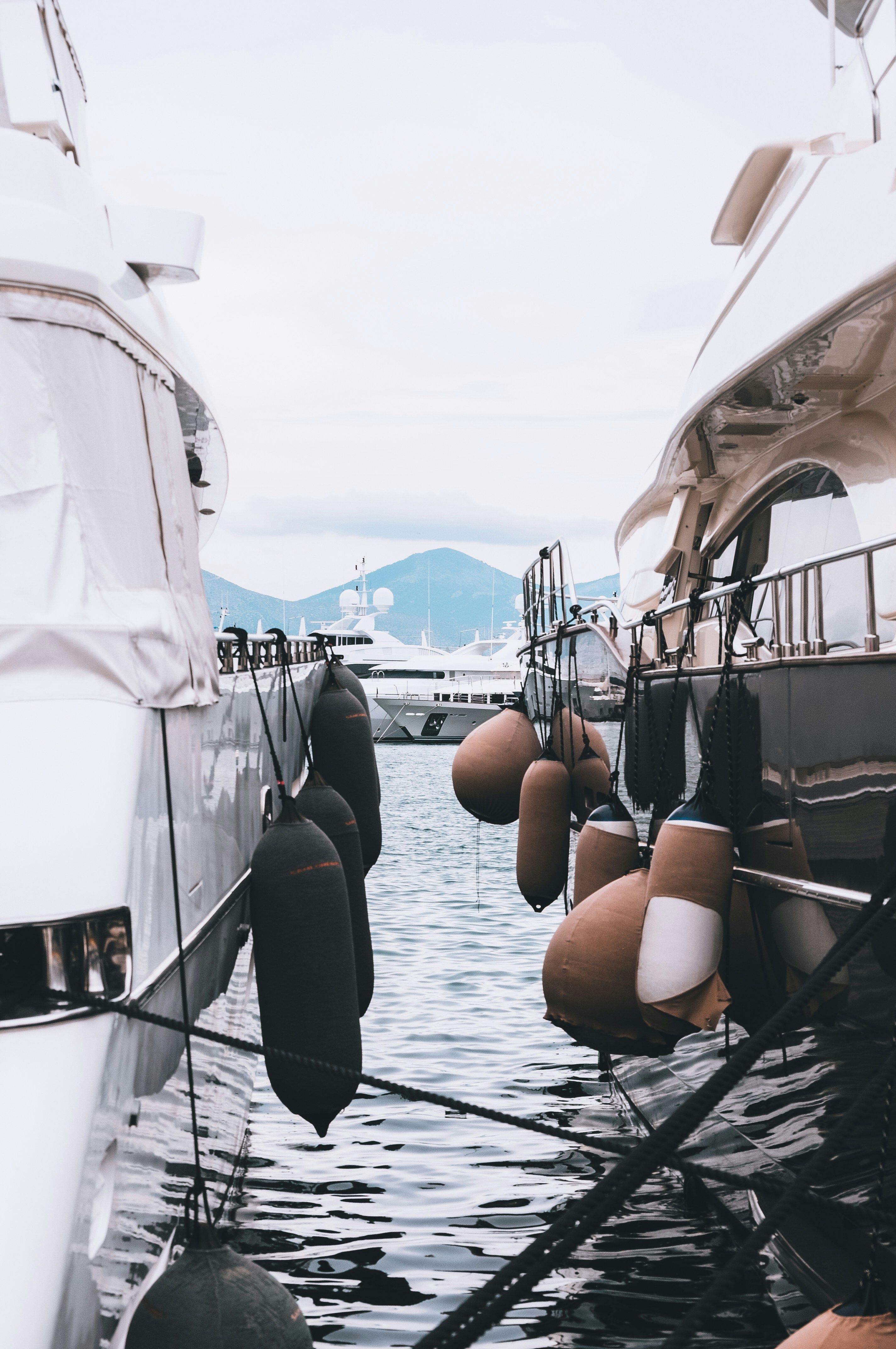 Midship Gap: A Symmetrical Marina Corridor Framed by Luxury Yachts
