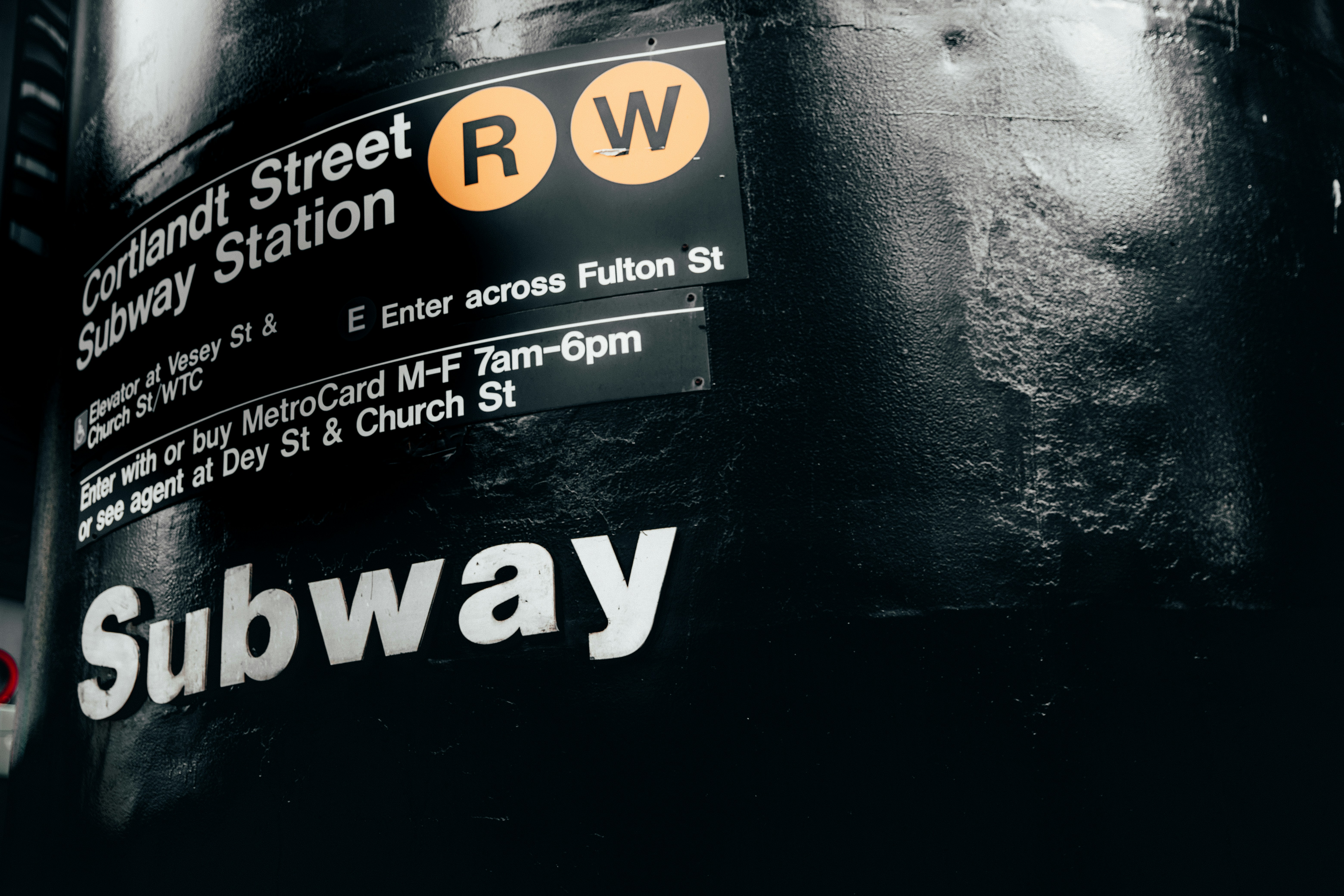 Subway Signage in Deep Contrast: The R/W Station Scene