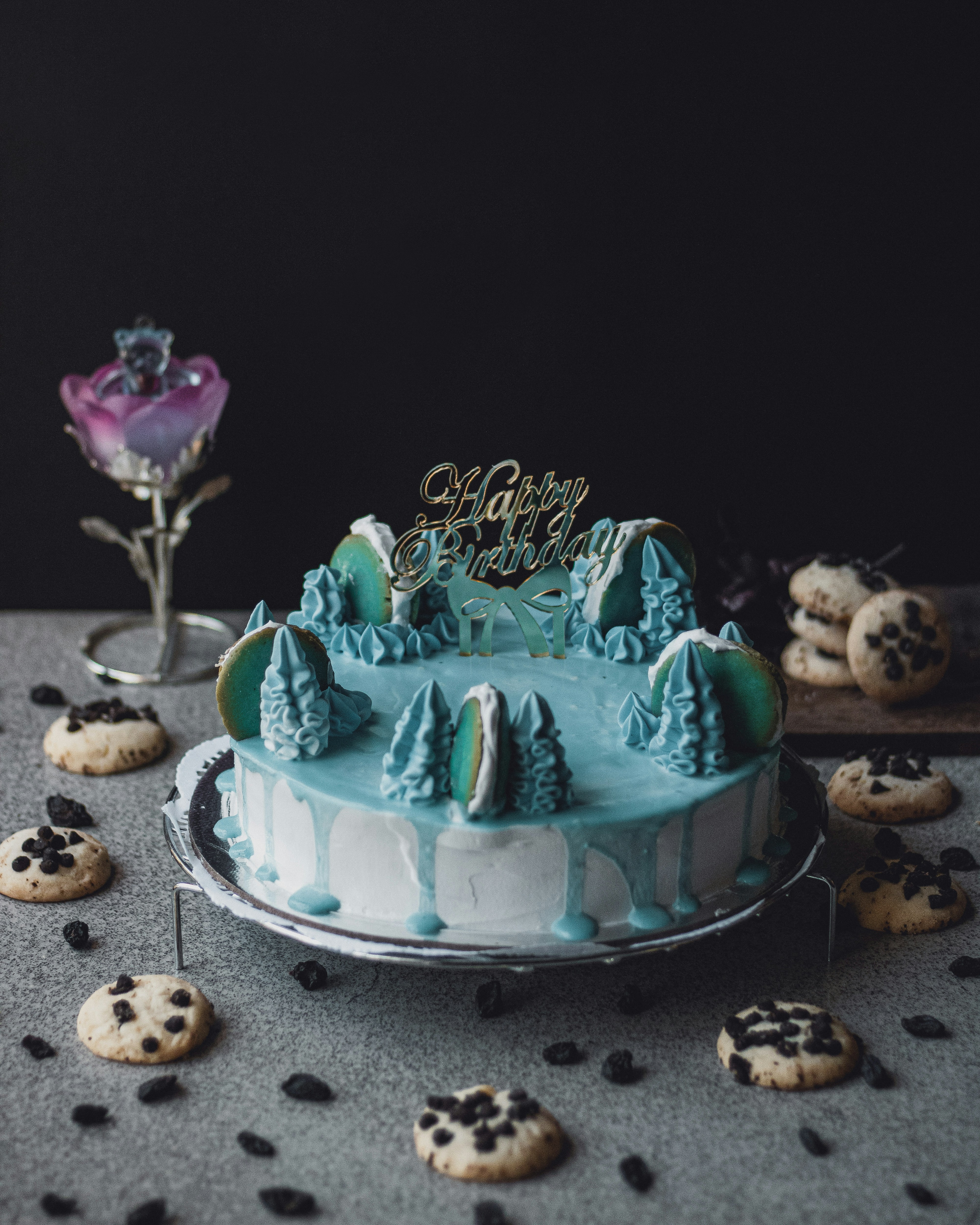Azure Drip Cake with Frosted Pine Trees and a Gold 'Happy Birthday' Topper