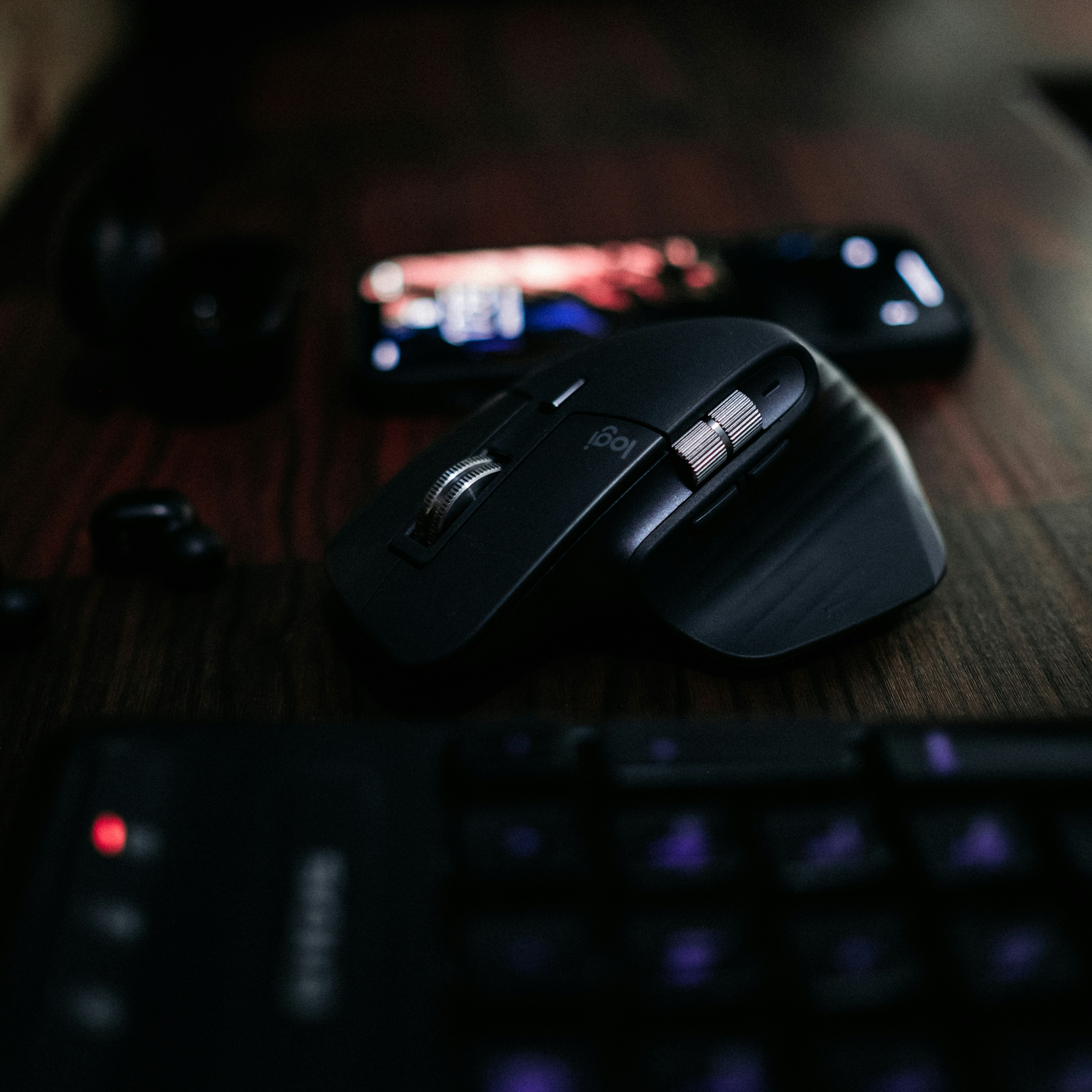 Black cordless computer mouse on brown wooden table photo – Free Dark ...