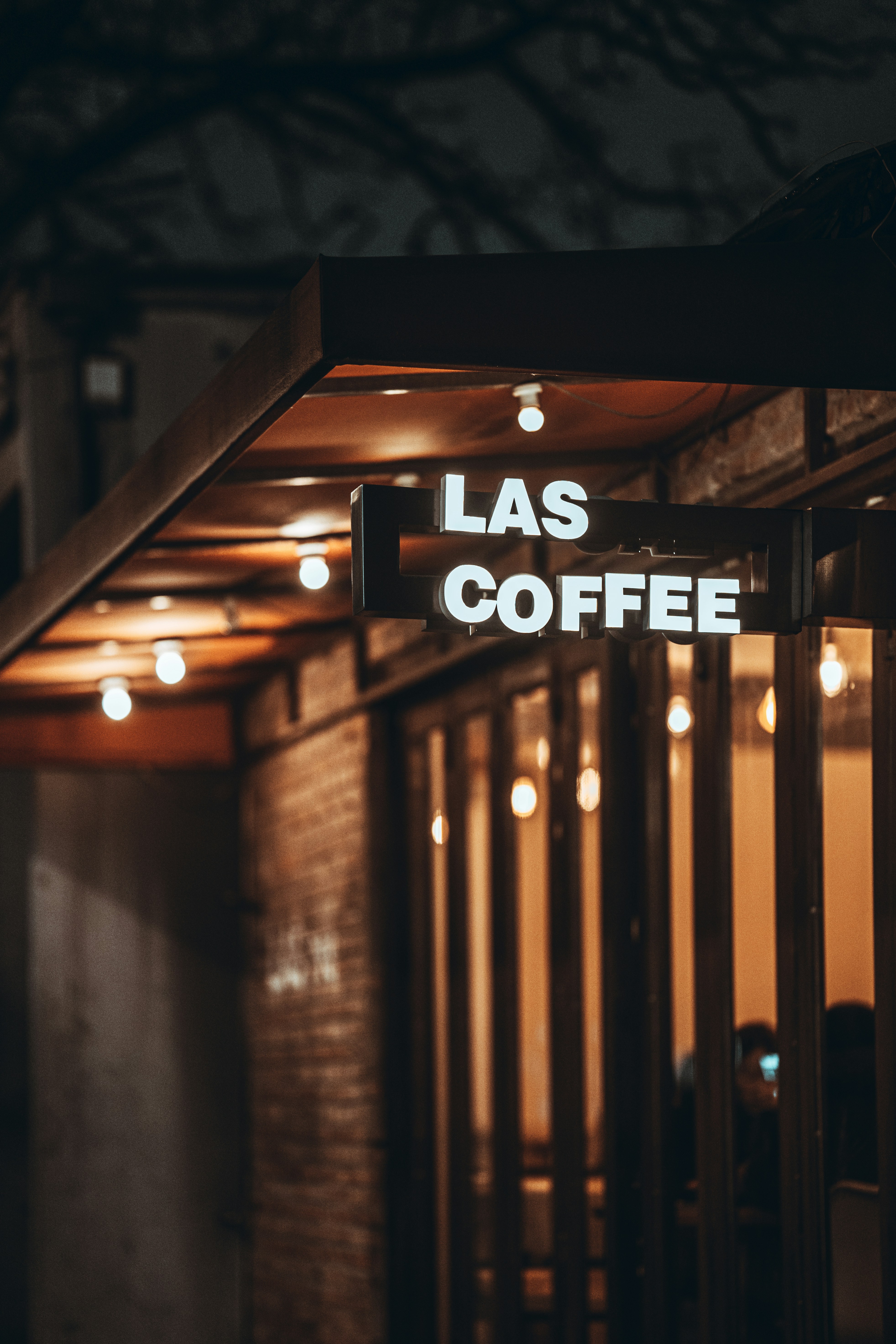 Las Coffee Glow: Nightlife Through a Glass-Walled Café