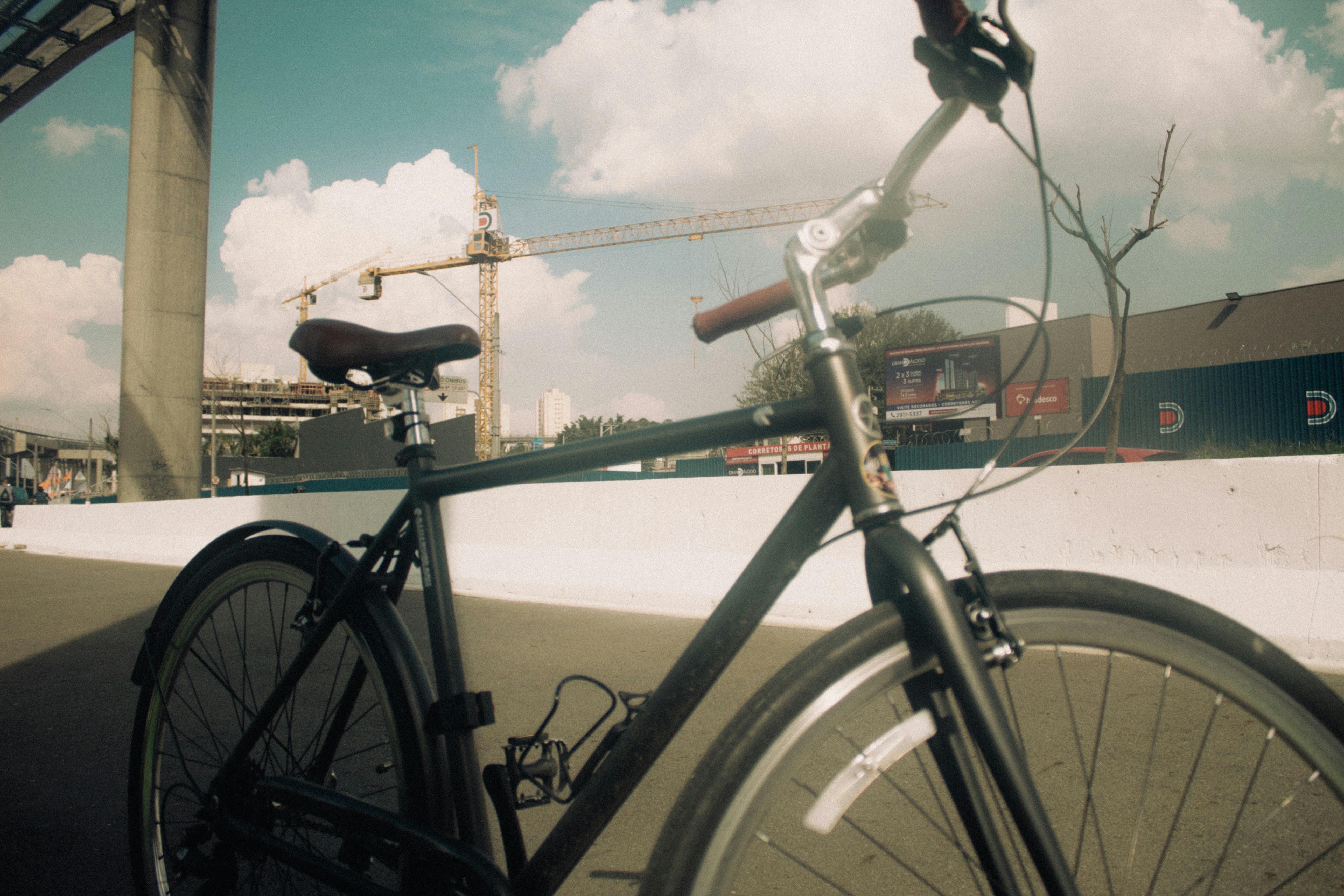 City Bike in Soft Focus Under a Crane-Stamped Sky