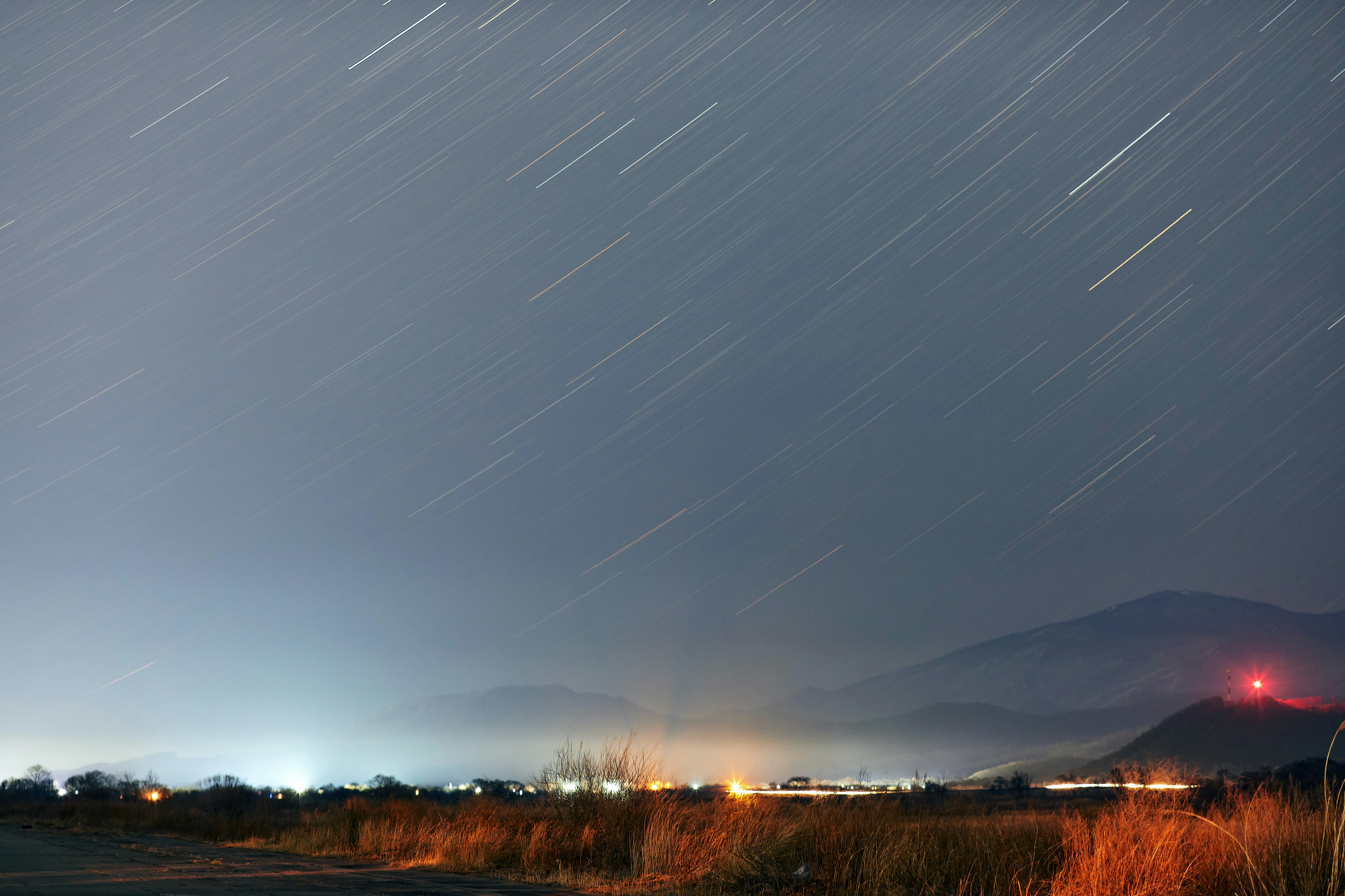 Red Ridge Beacon Beneath a River of Star Trails