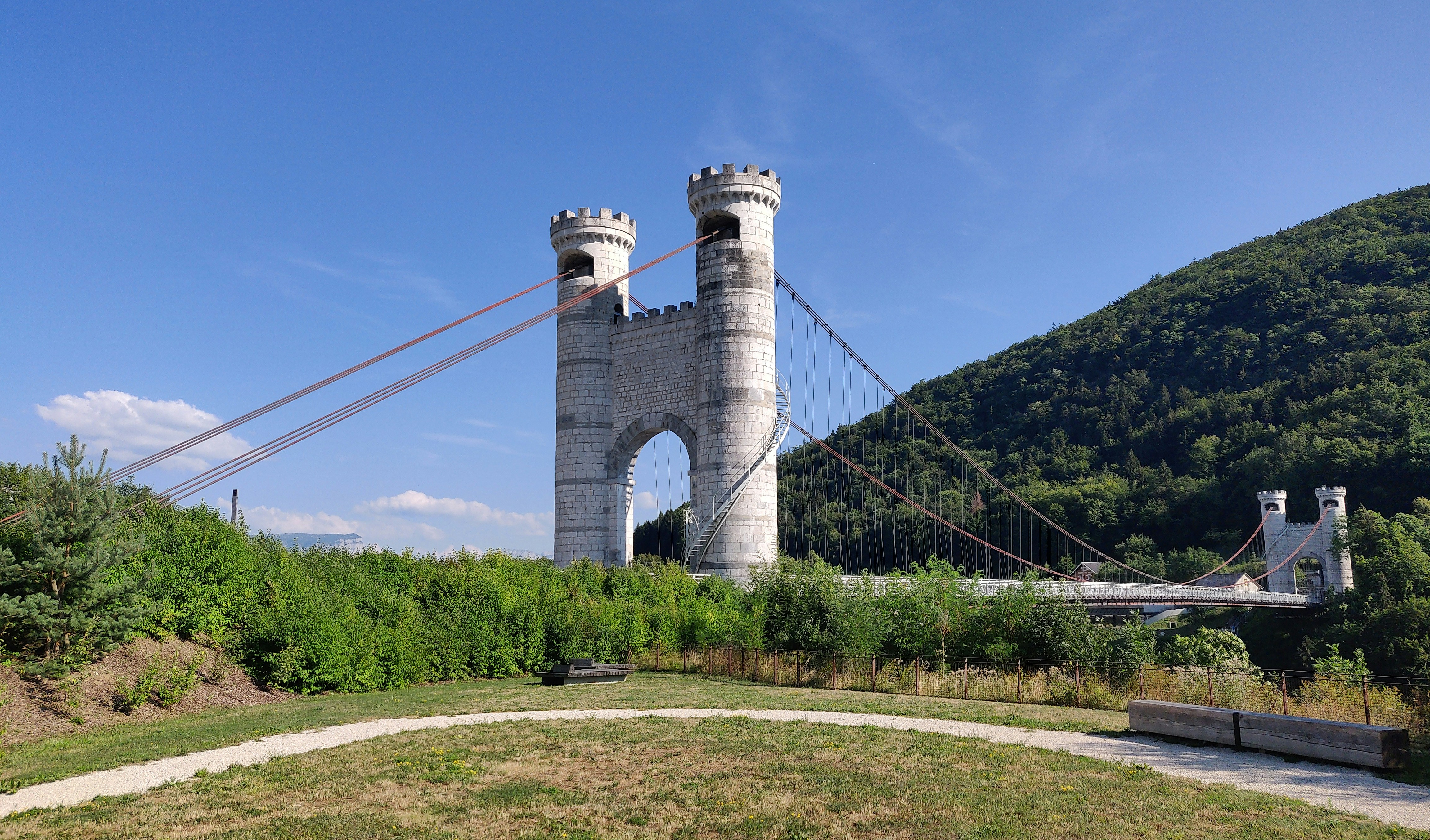 Twin-Tower Suspension Over a Verdant Gorge