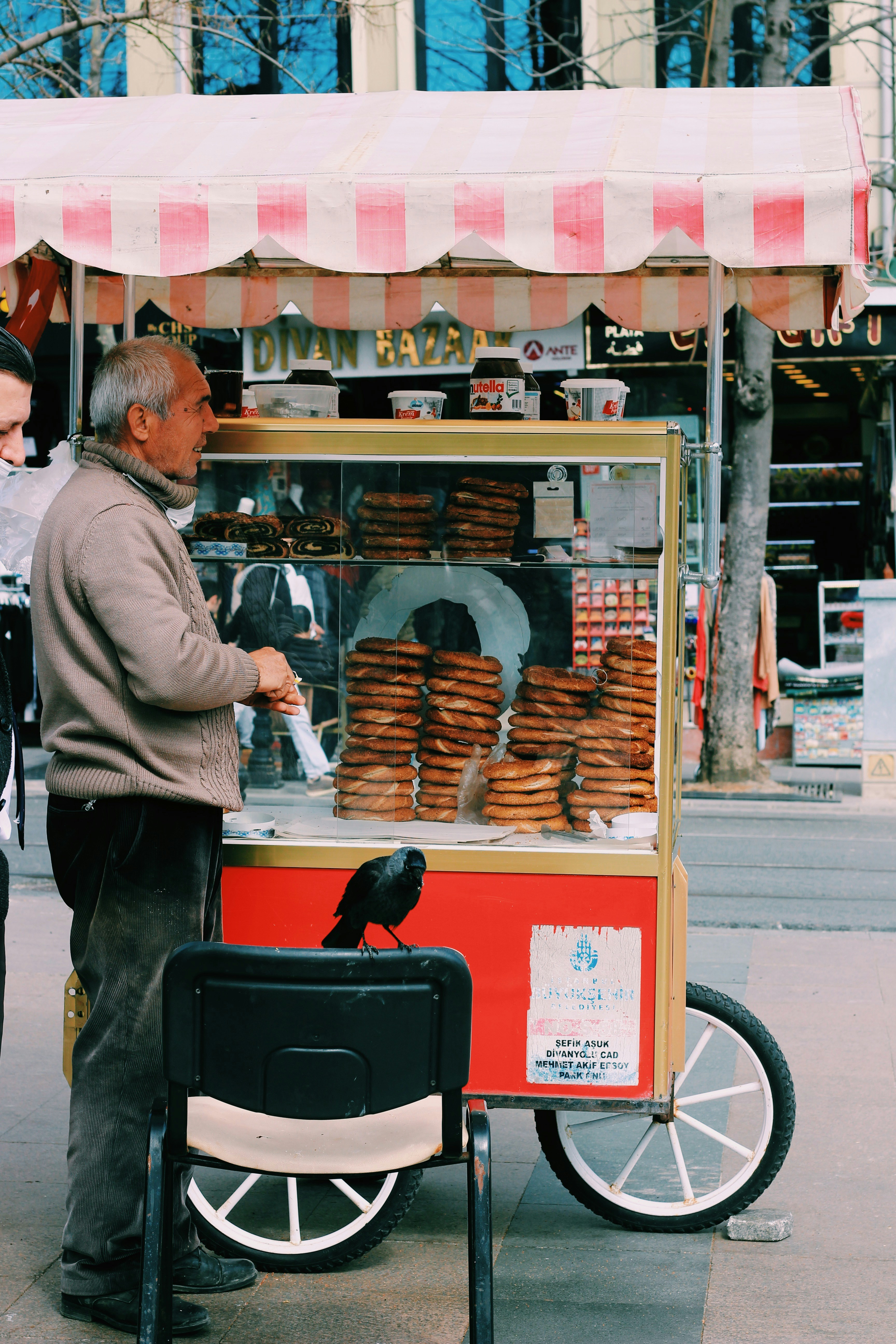 Under Pink Stripes: Bagels, A Man, and a City Moment