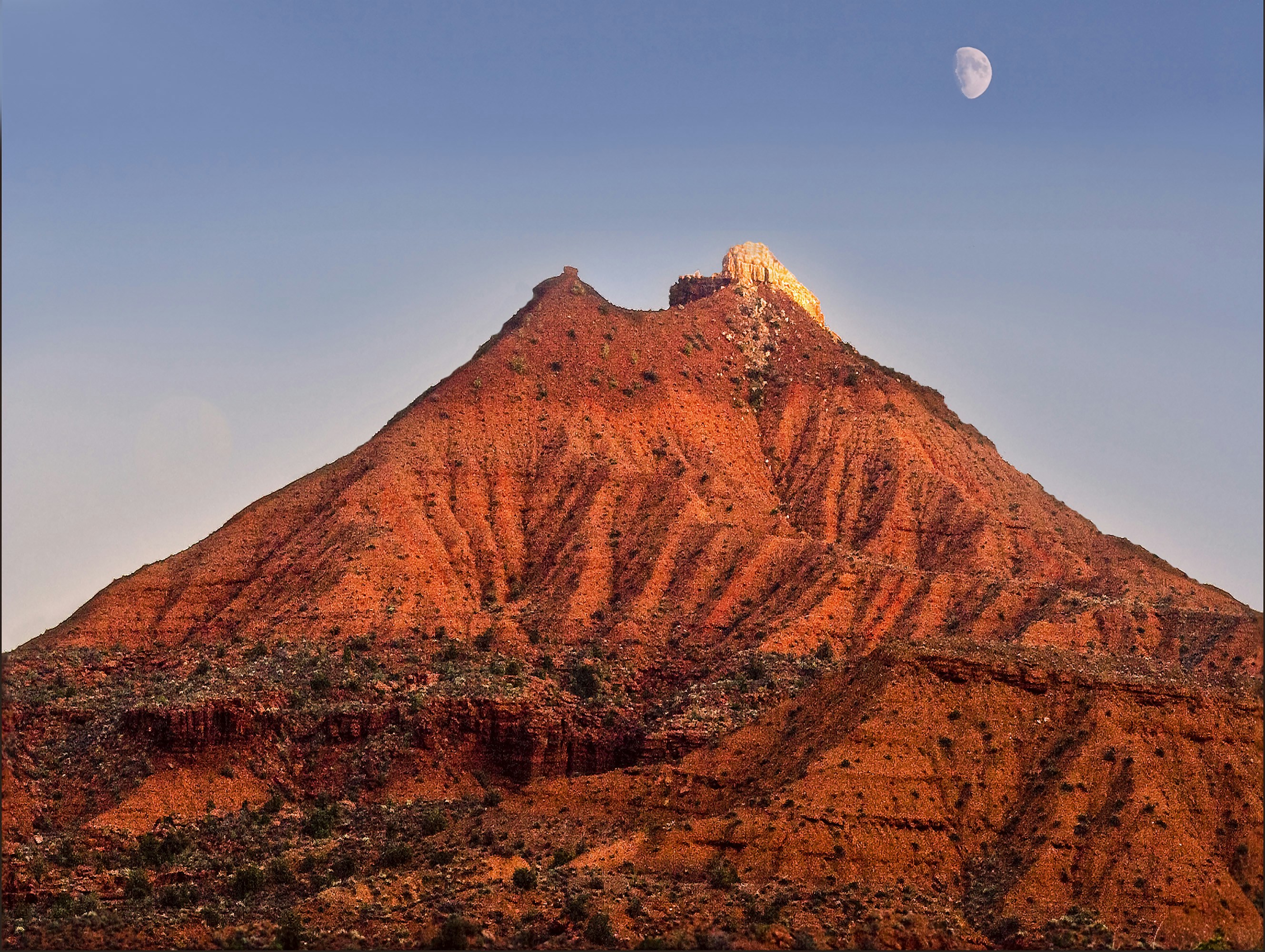 brown rocky mountain under blue sky during daytime