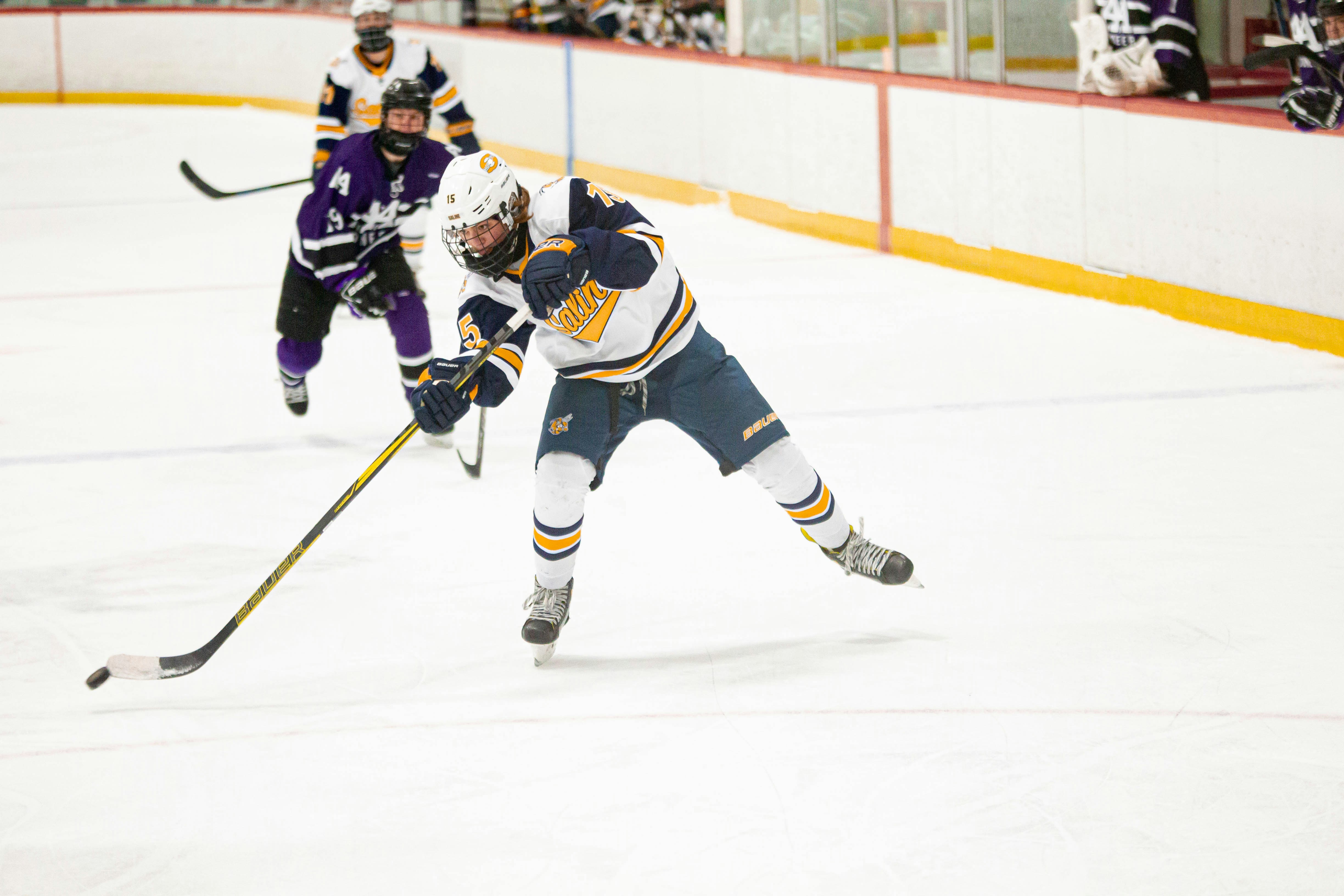 Skating Strike: A Player Drives the Puck Across the Ice