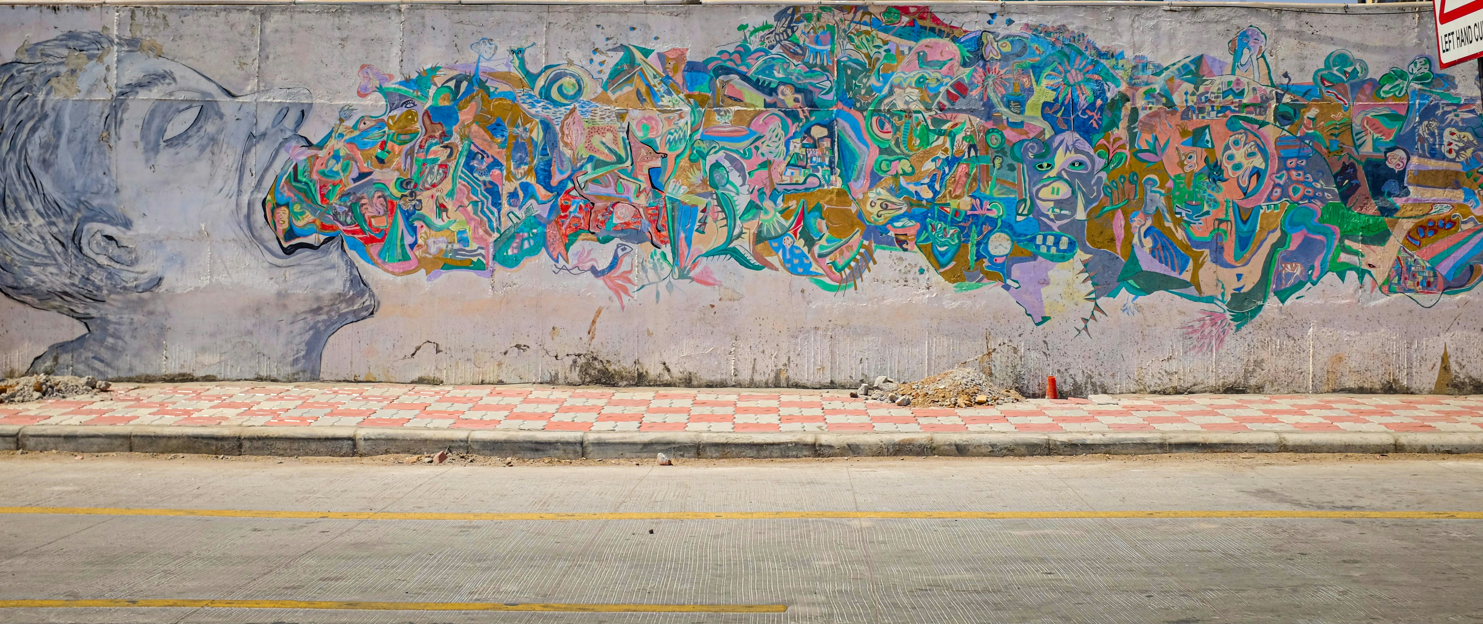 blue and white graffiti on wall