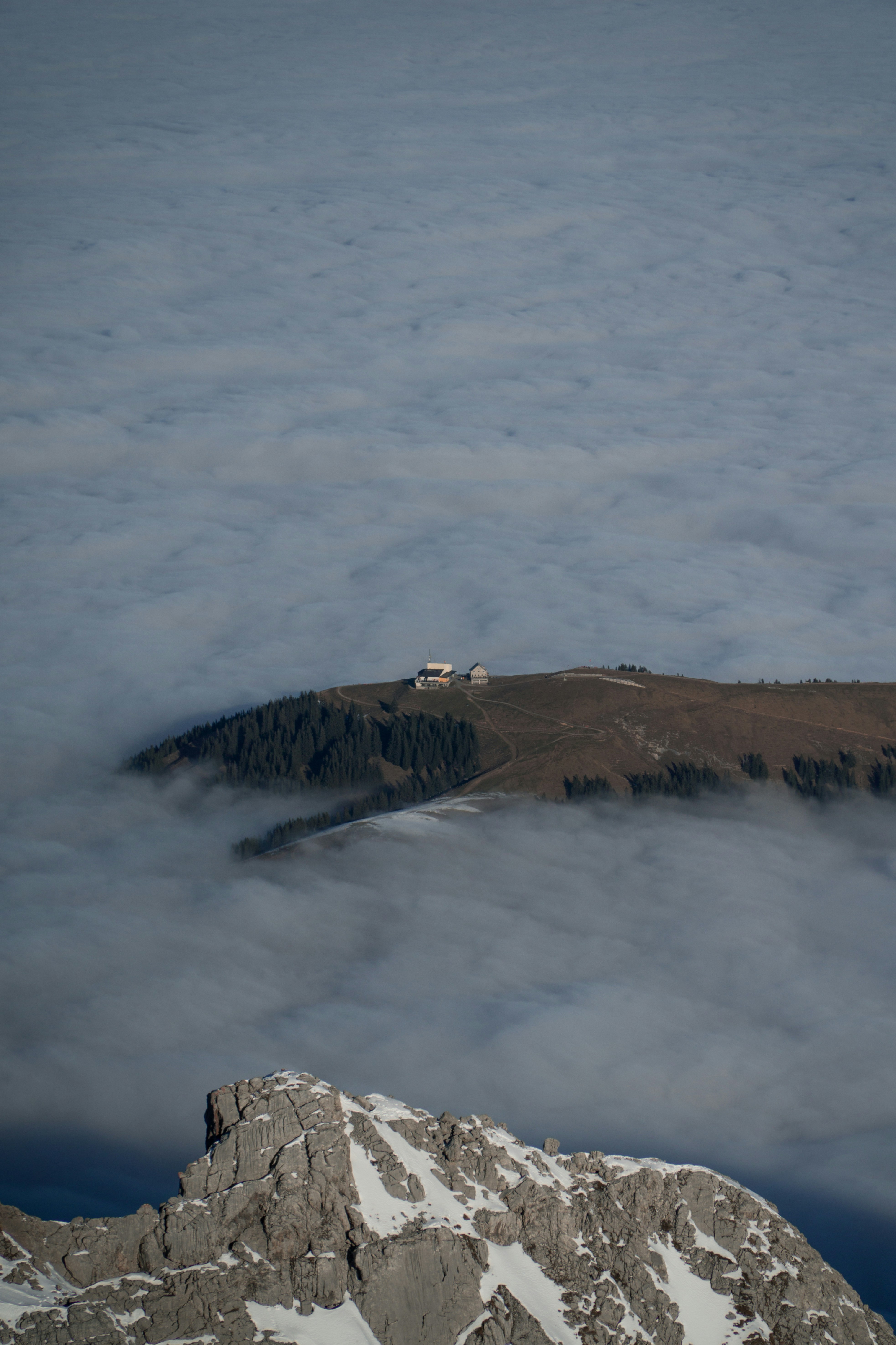 Alpine Cabin Hovering Above a Sea of Clouds