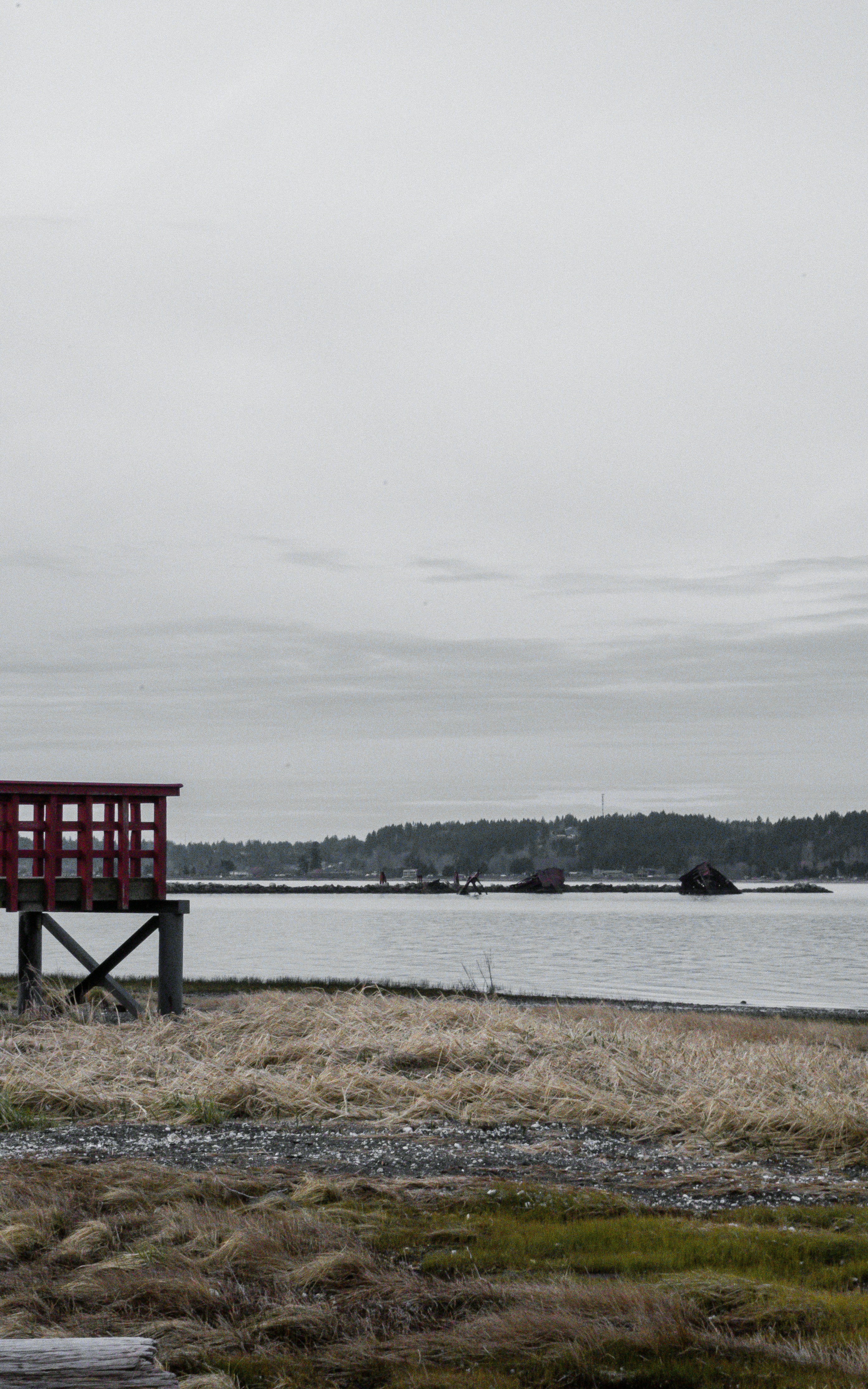 Red Pier Over Sandy Vista at Dusk