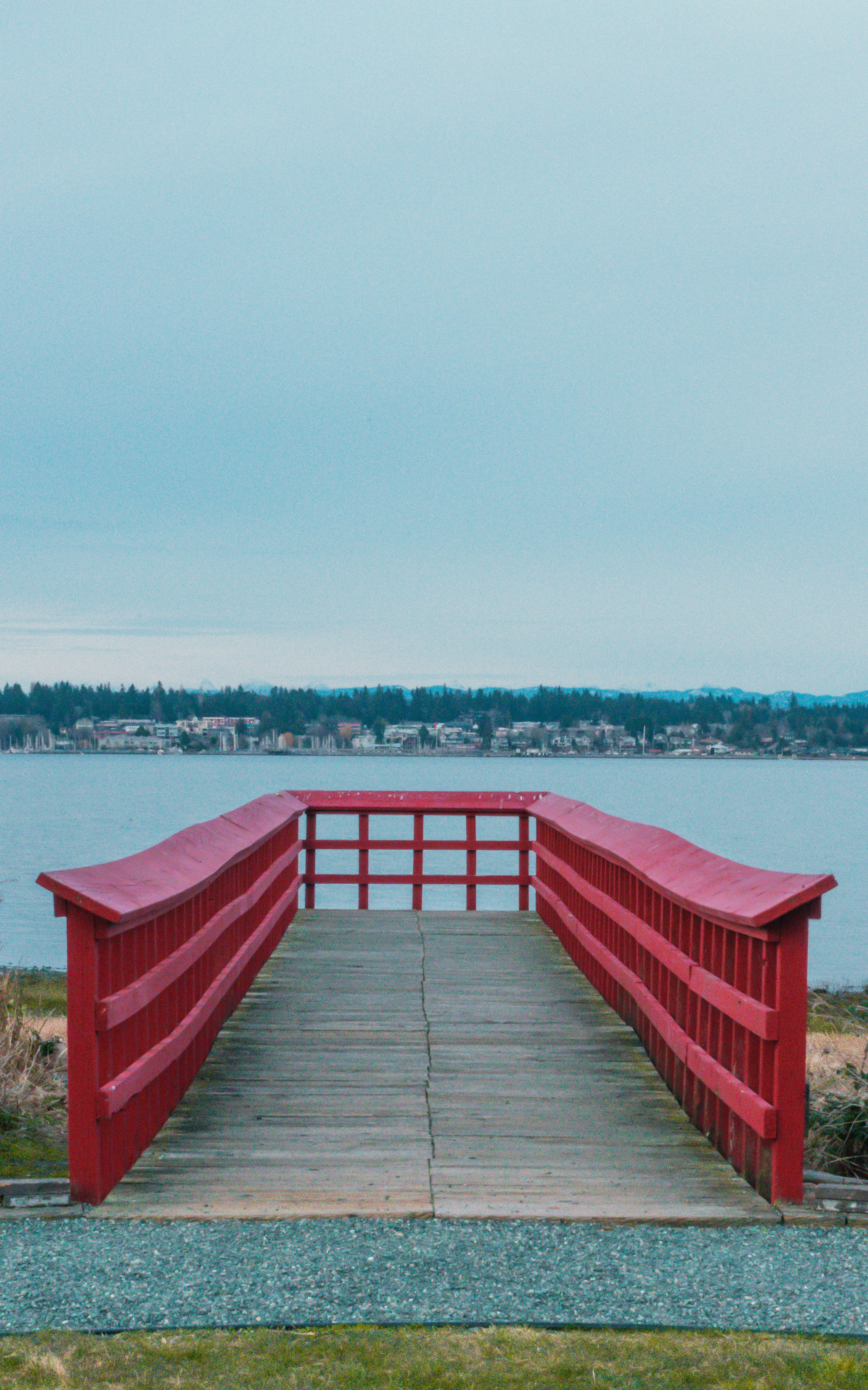 brown wooden dock on body of water during daytime