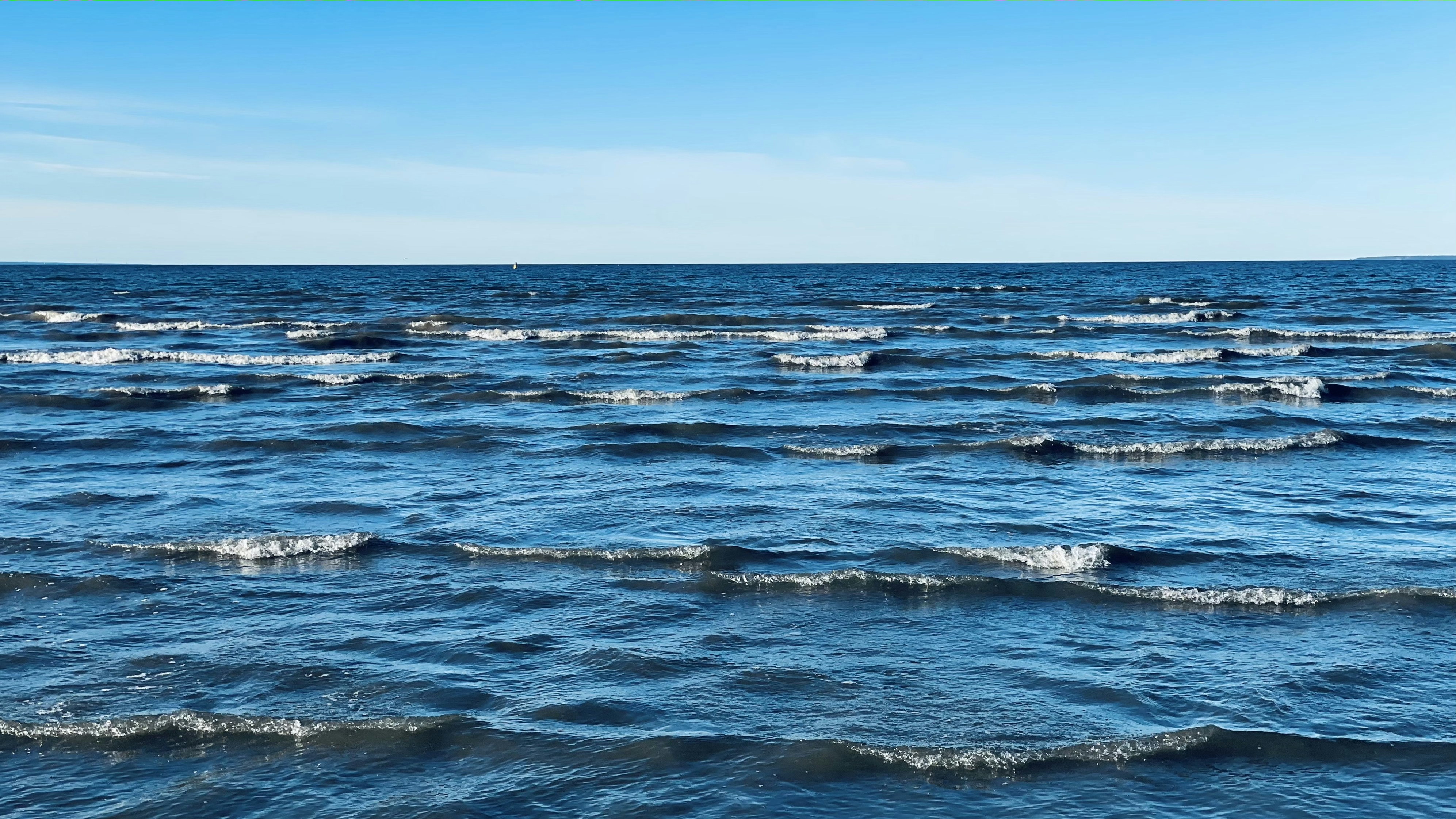 blue ocean water under blue sky during daytime