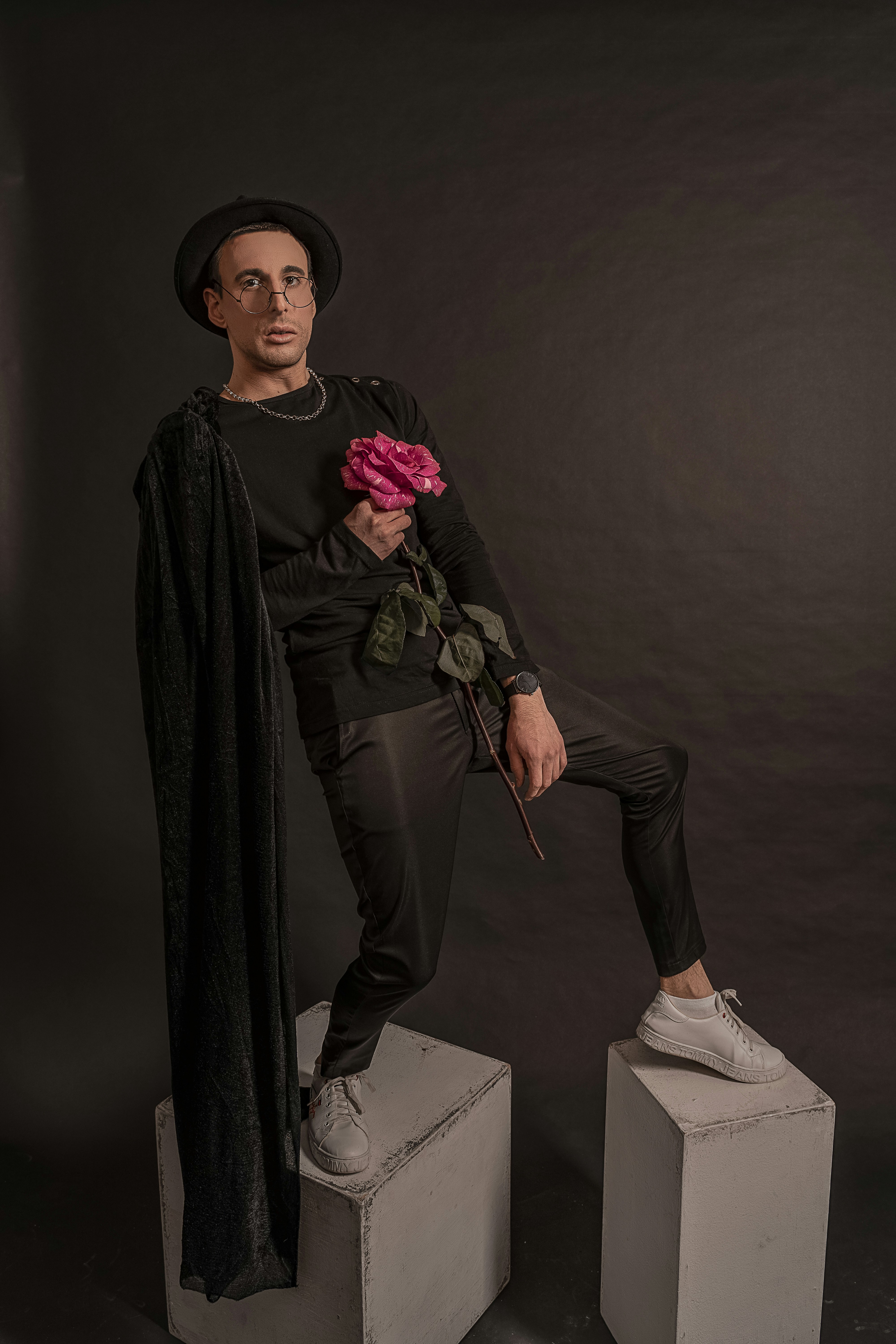 Velvet Silence: A Rose-Clad Portrait atop Studio Pedestals