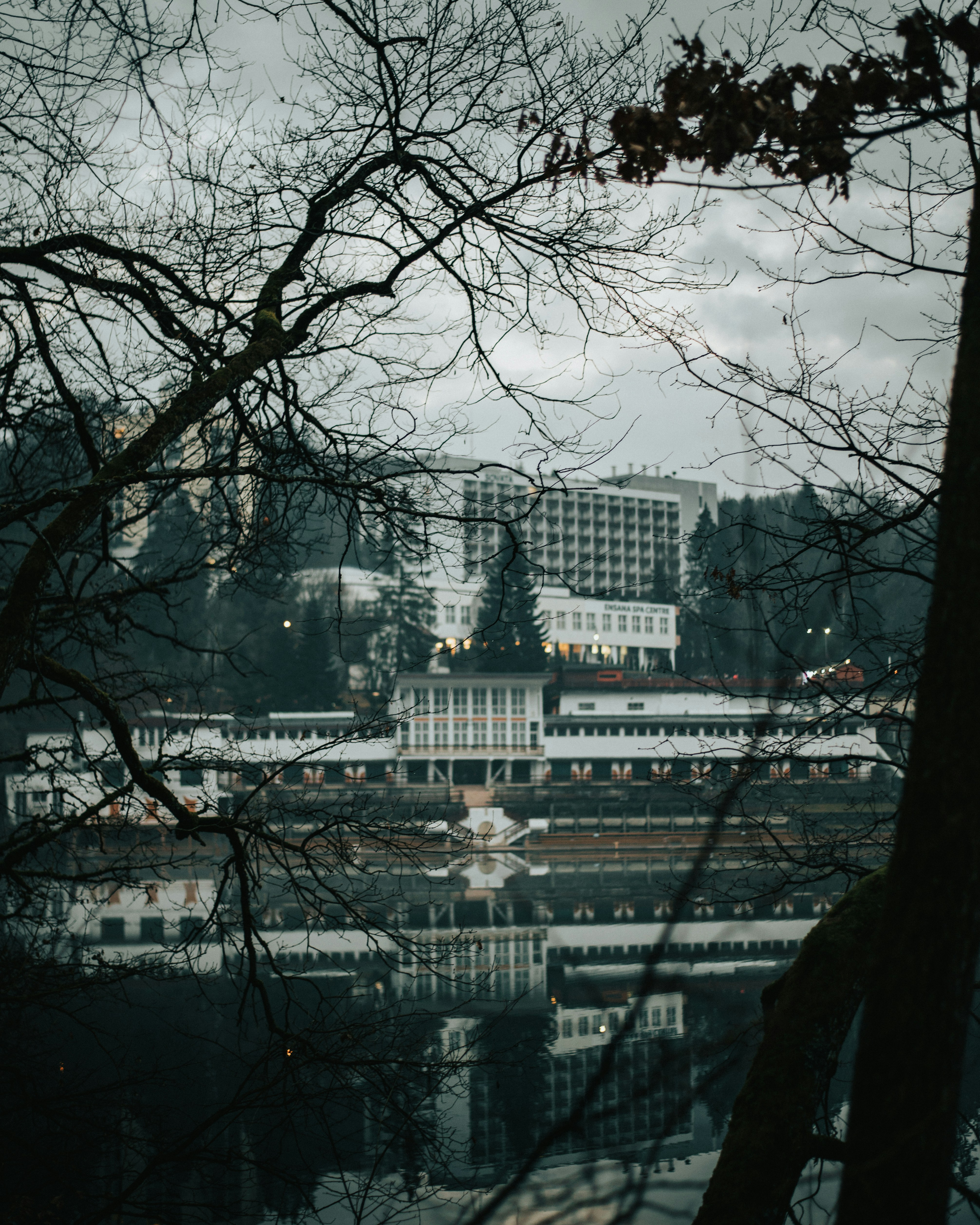 White concrete building near body of water during daytime photo – Free ...