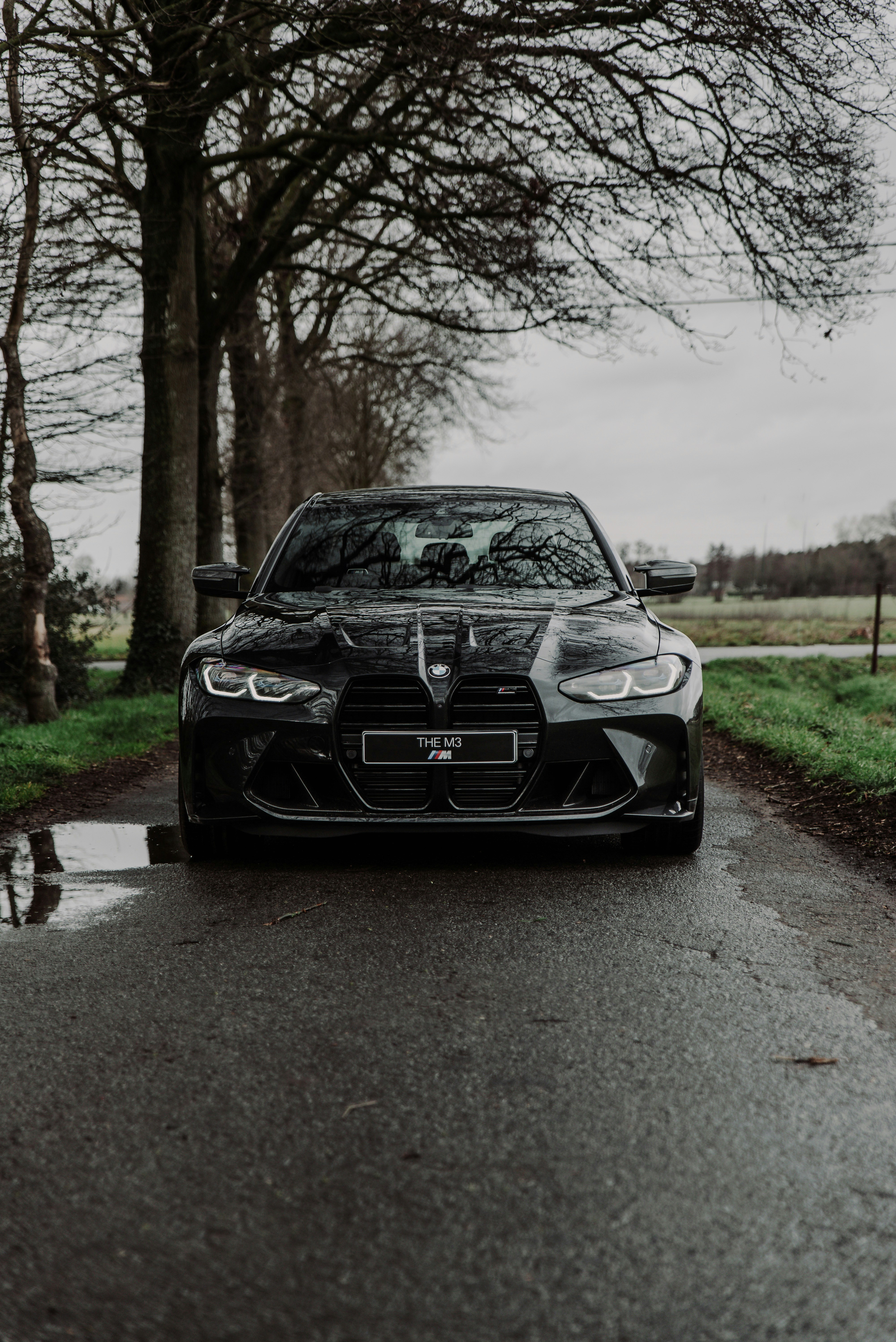 Front-and-center: The M3 Stands Guard on a Rain-Washed Road