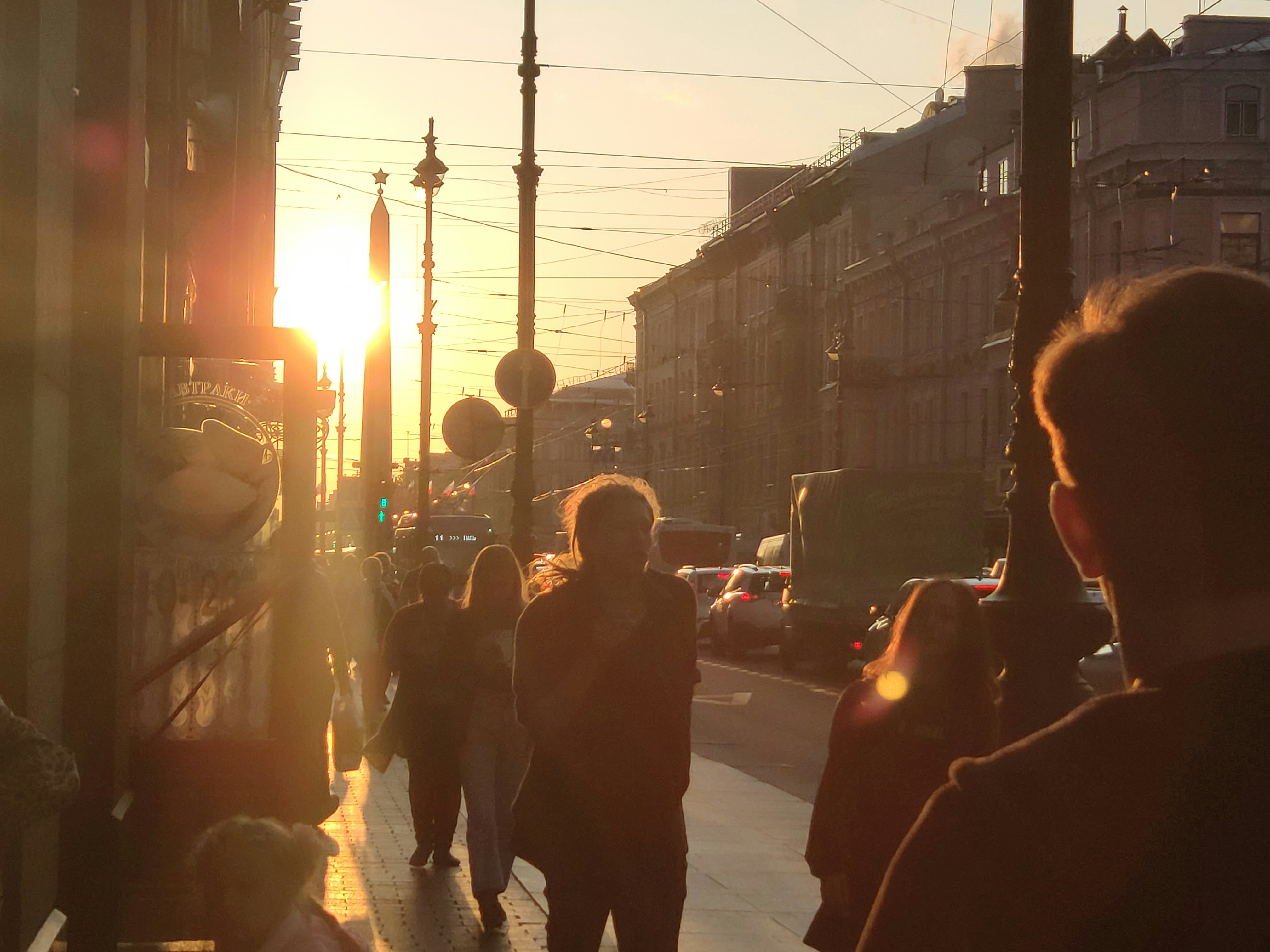 Sunburst Over a Dusk Street: Silhouettes and Urban Glow