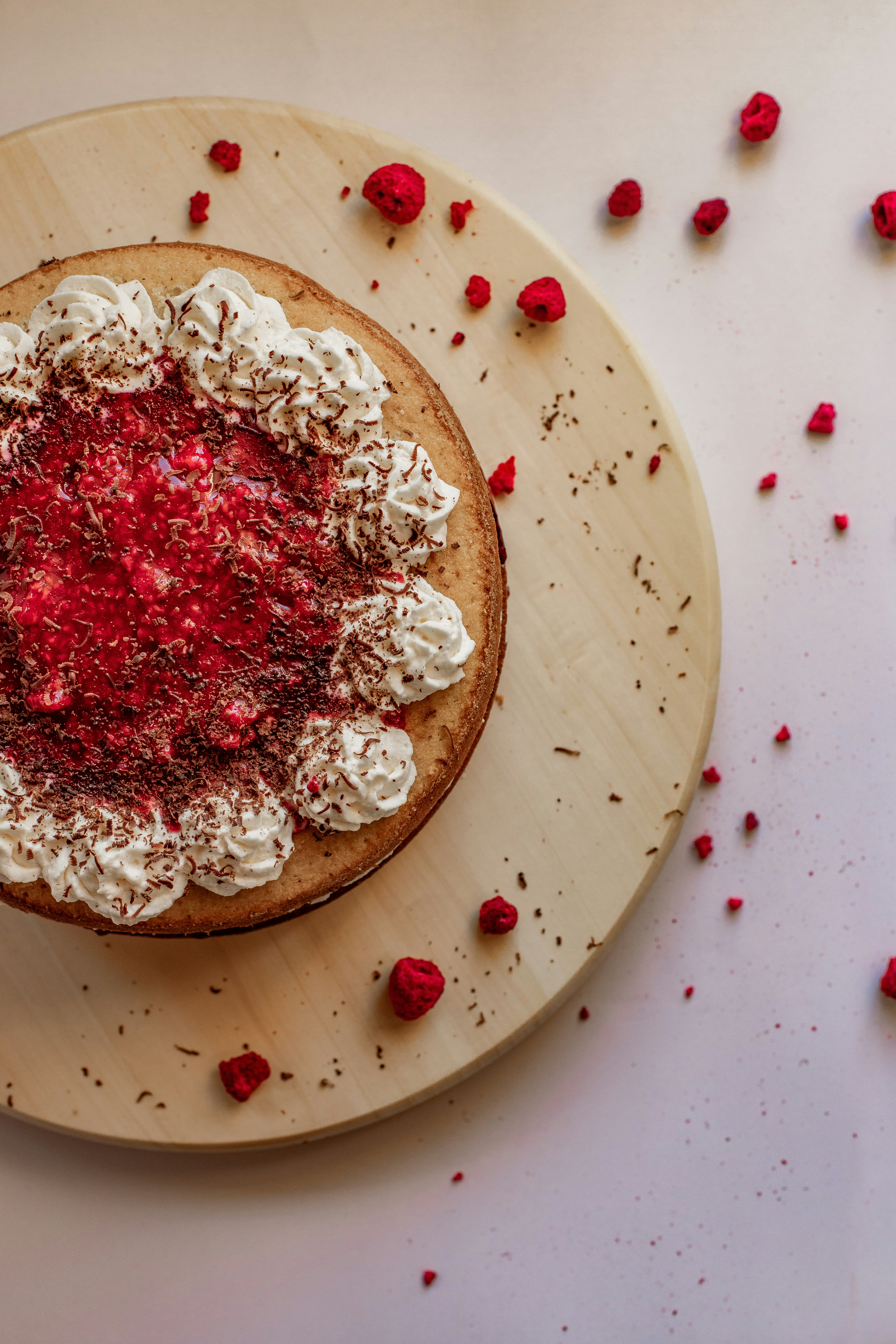 Red and white round cake on white ceramic plate photo – Free Food Image ...