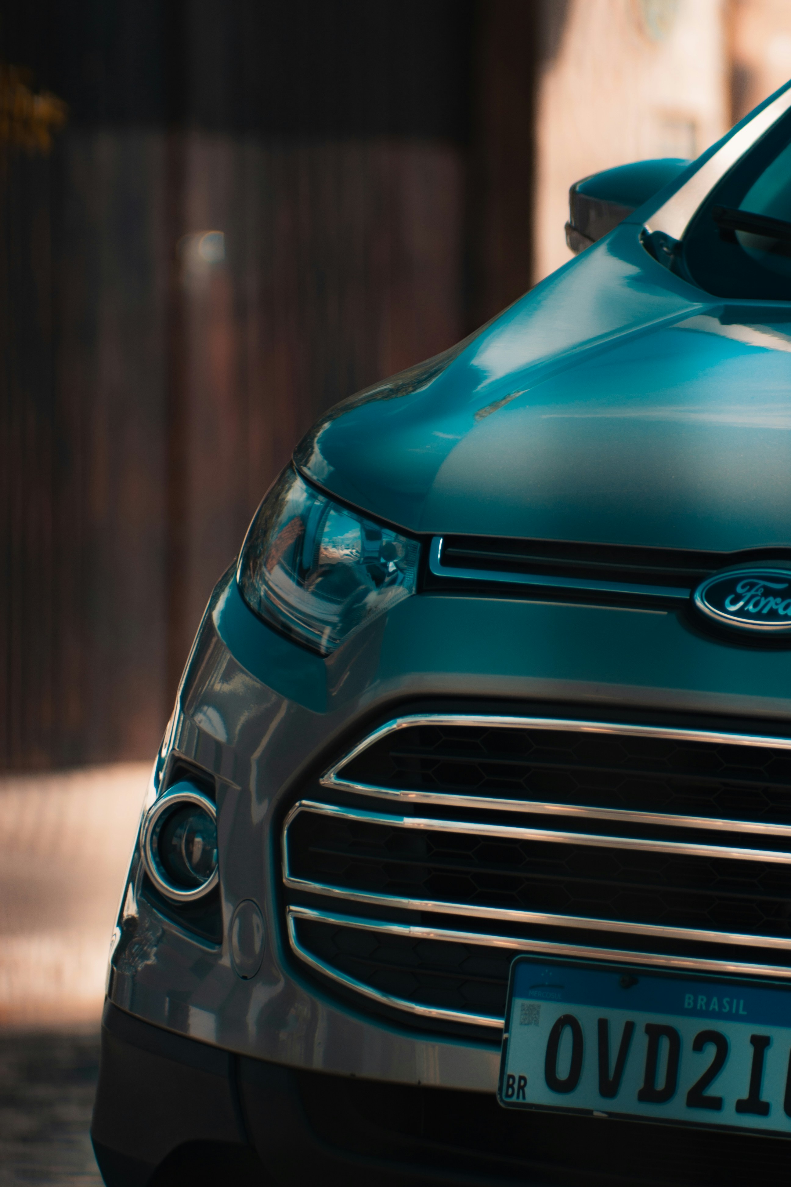 Teal Ford Front End: Chrome Grille Gleam and a Brazil Plate