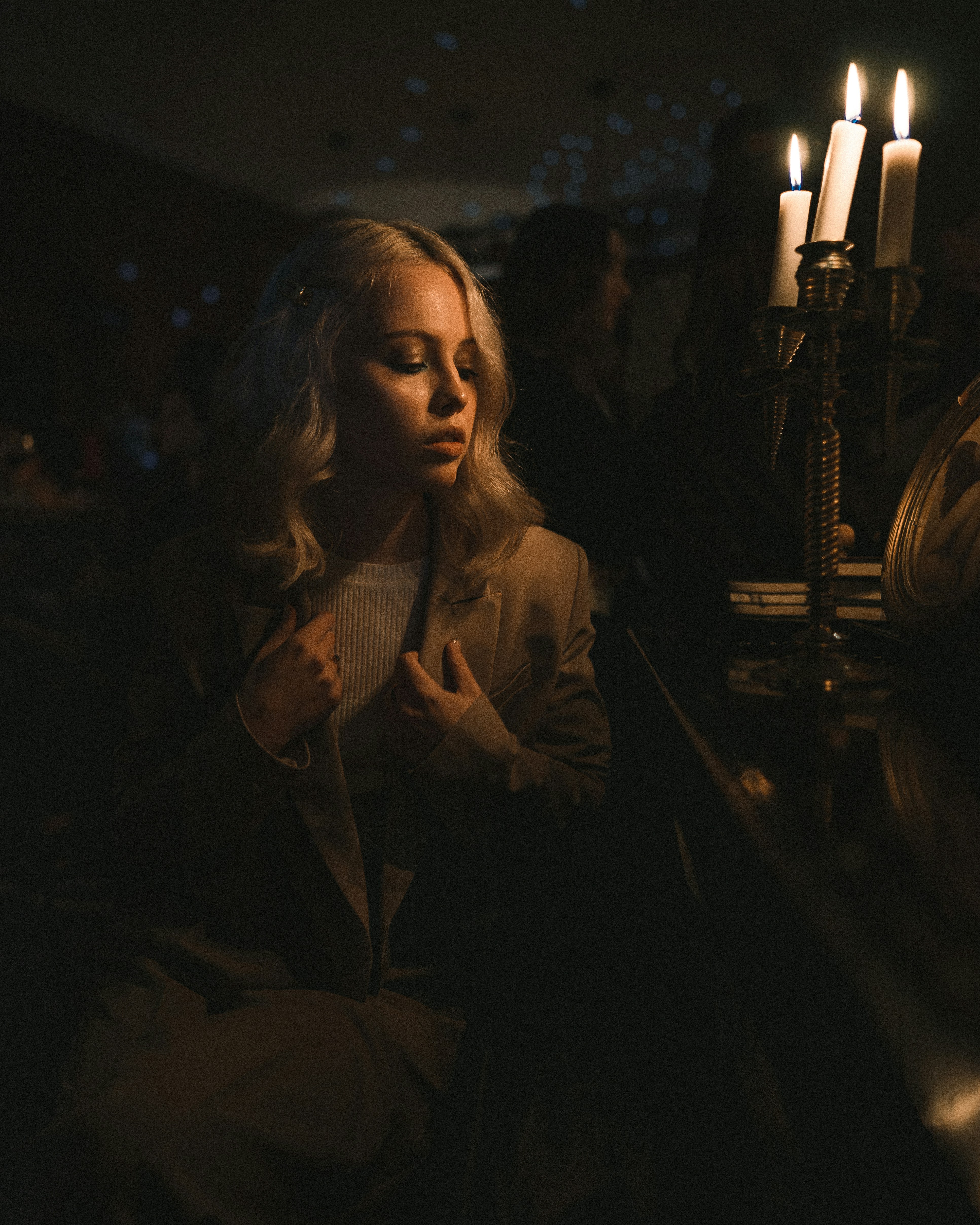 Candlelit Contemplation: A Quiet Moment in Velvet Darkness