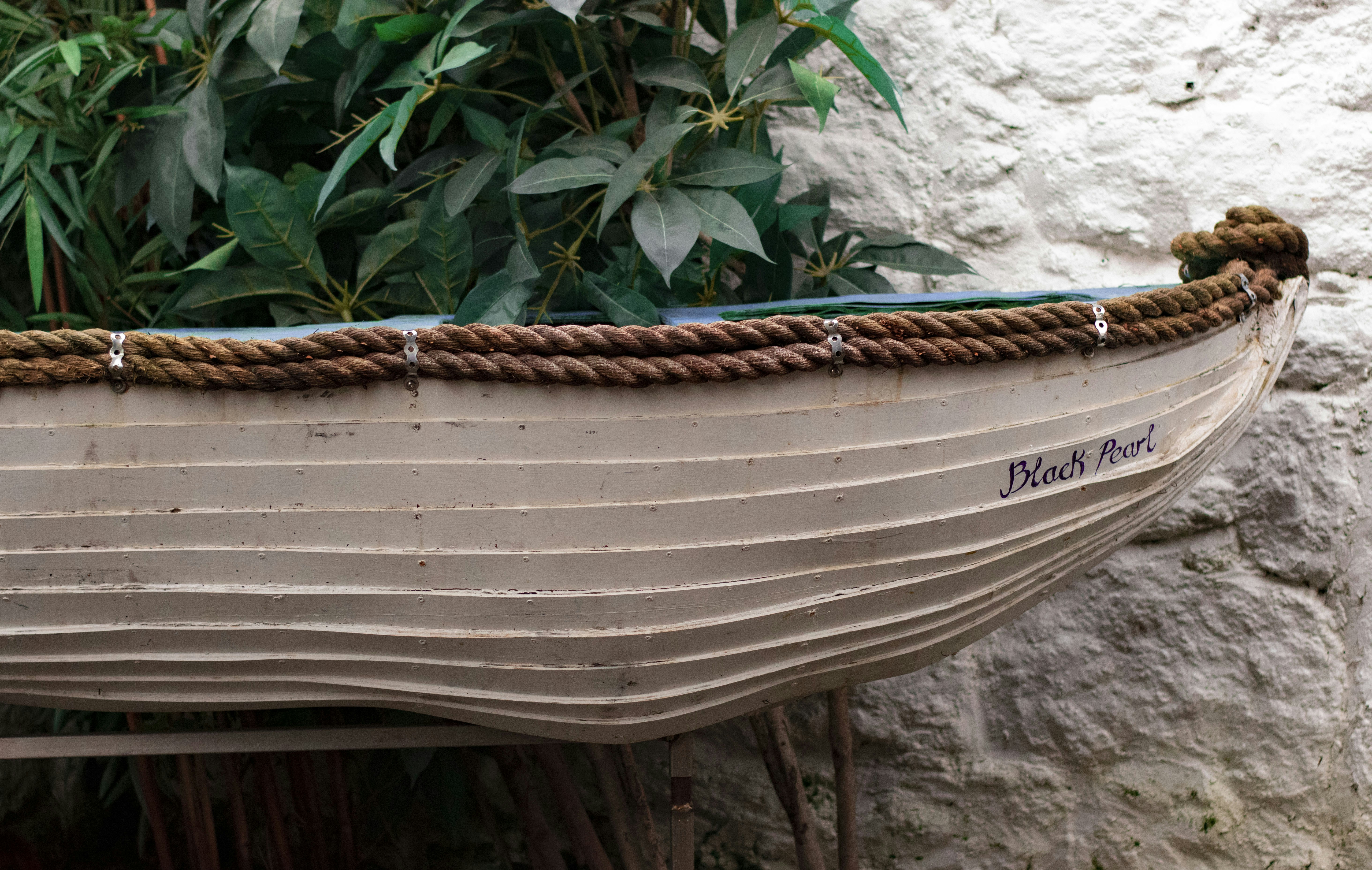 white and brown boat on brown wooden table