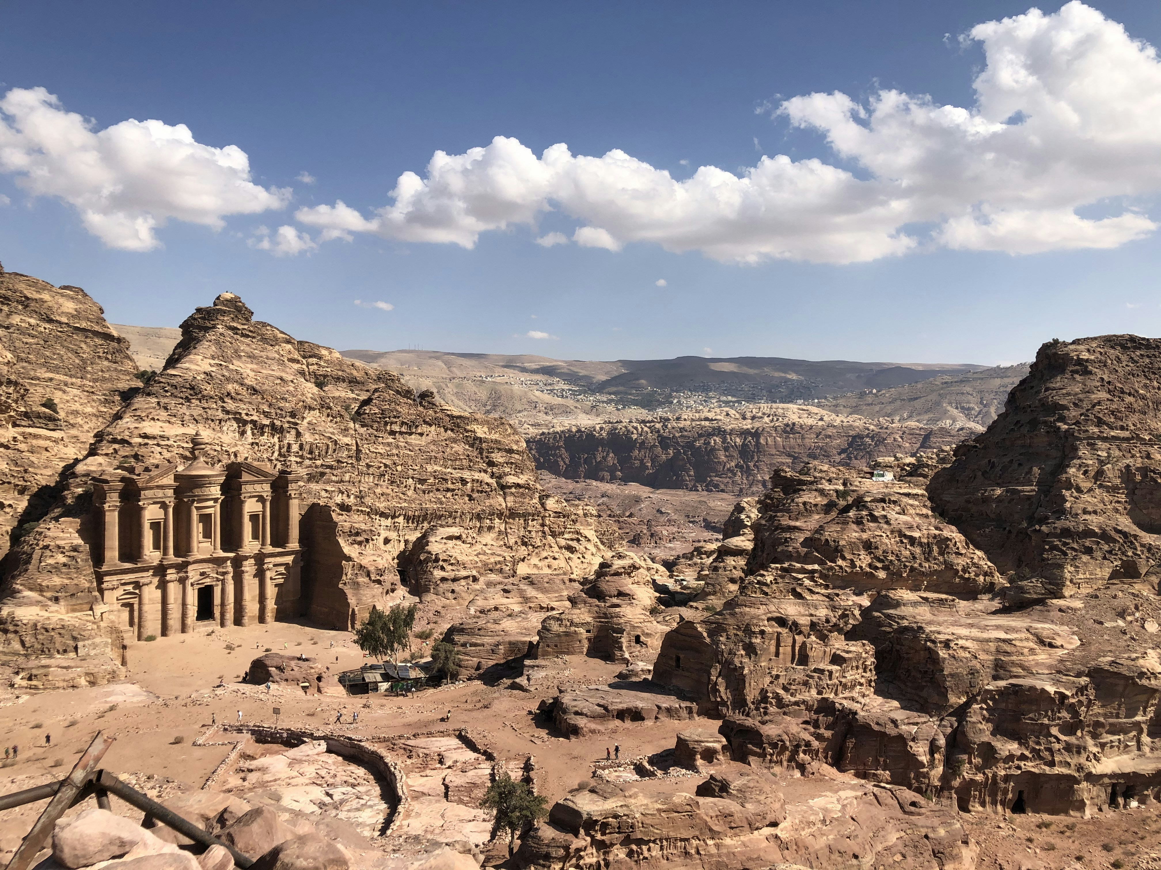 Carved Fortress in the Red Canyon Under a Patchwork Sky