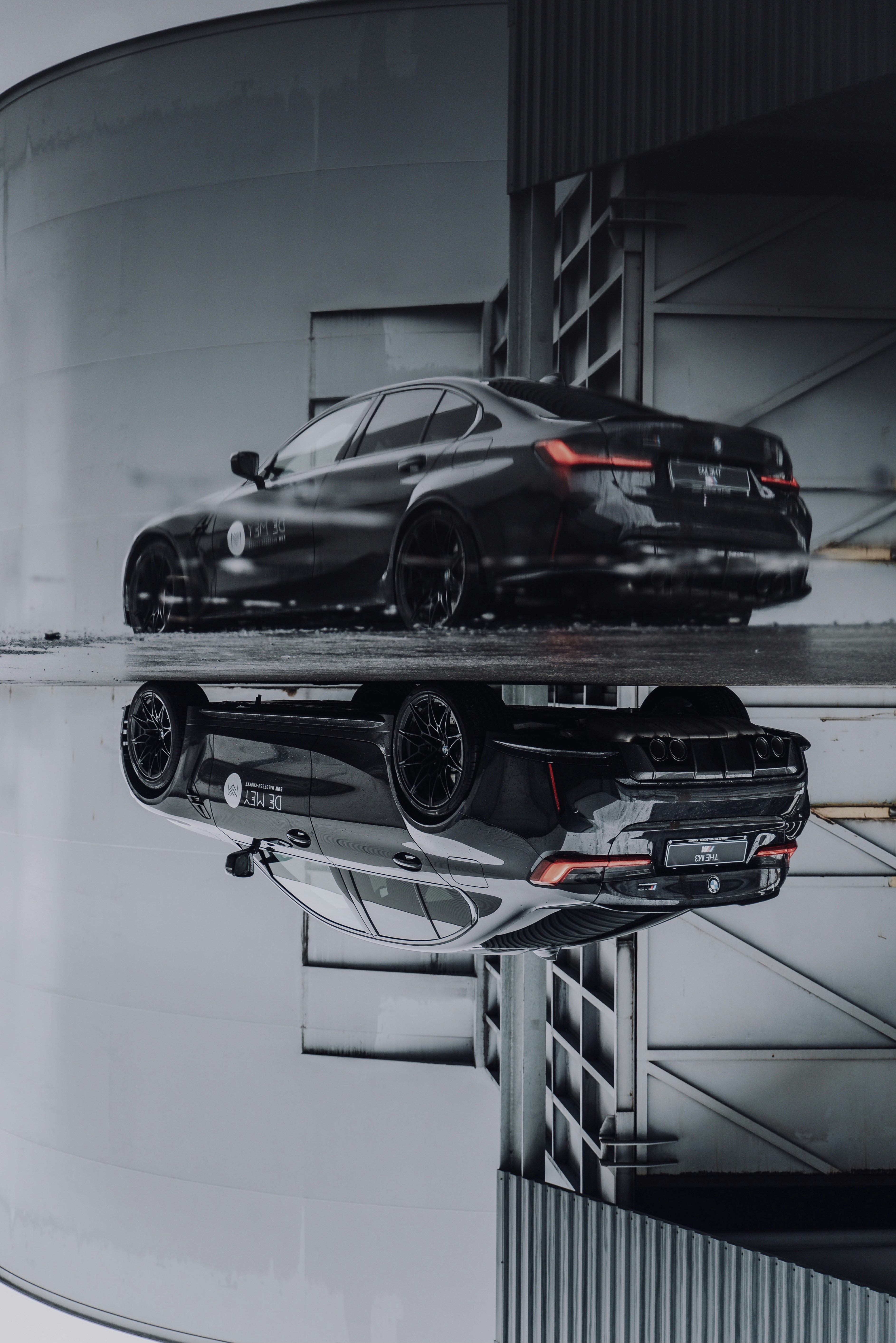 Liquid Mirror: A Black Porsche Rests On Its Own Reflection