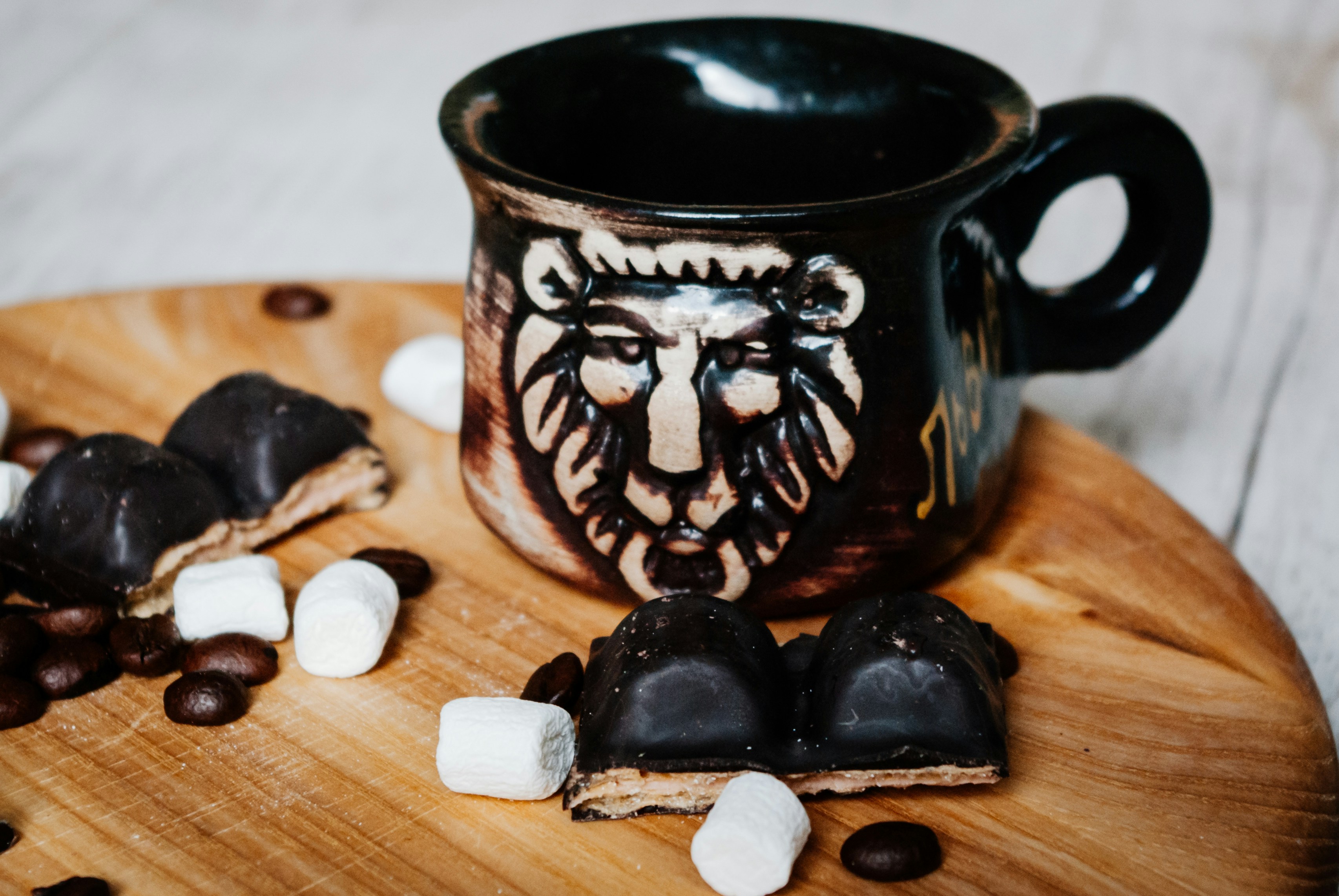 Tiger-mug serenity with cocoa bites on a wooden board